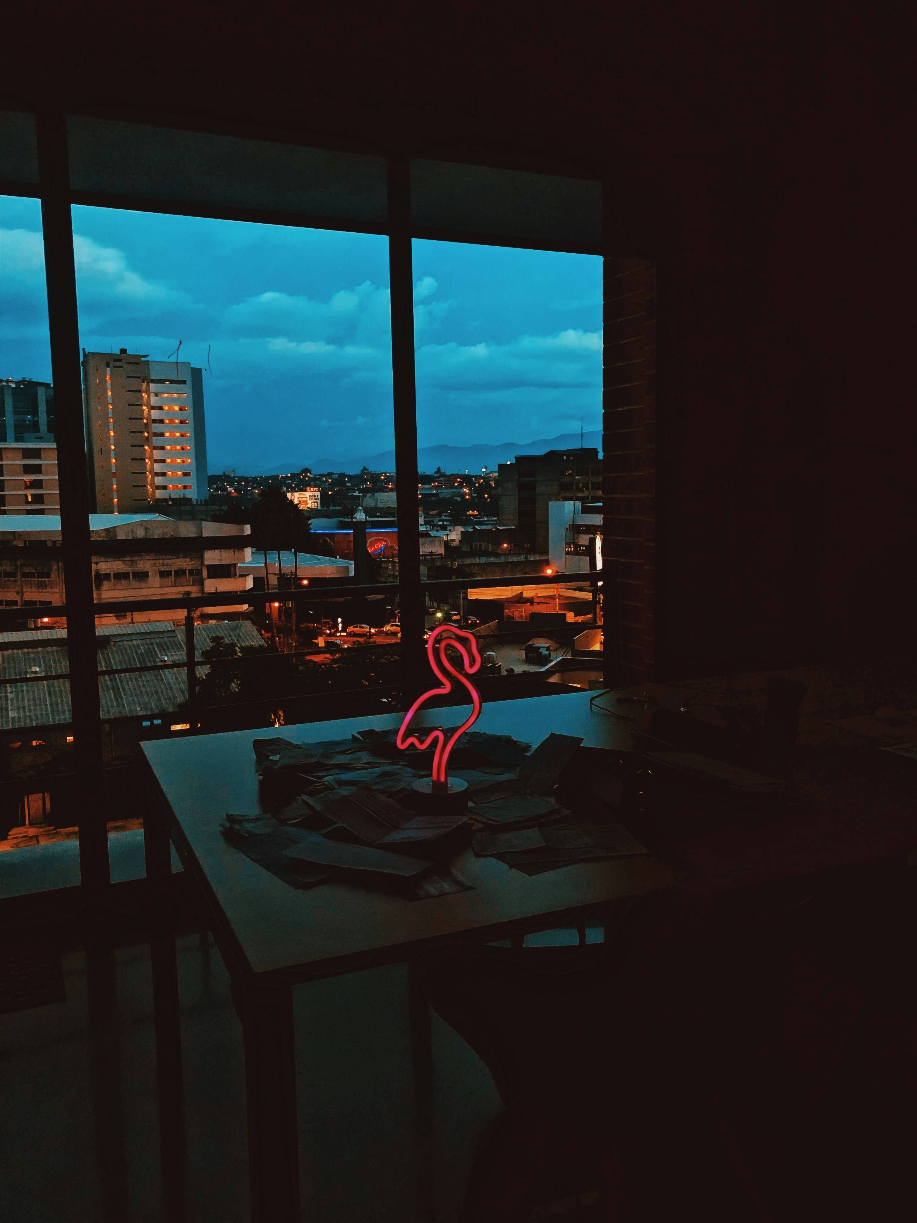 pink flamingo LED light on table