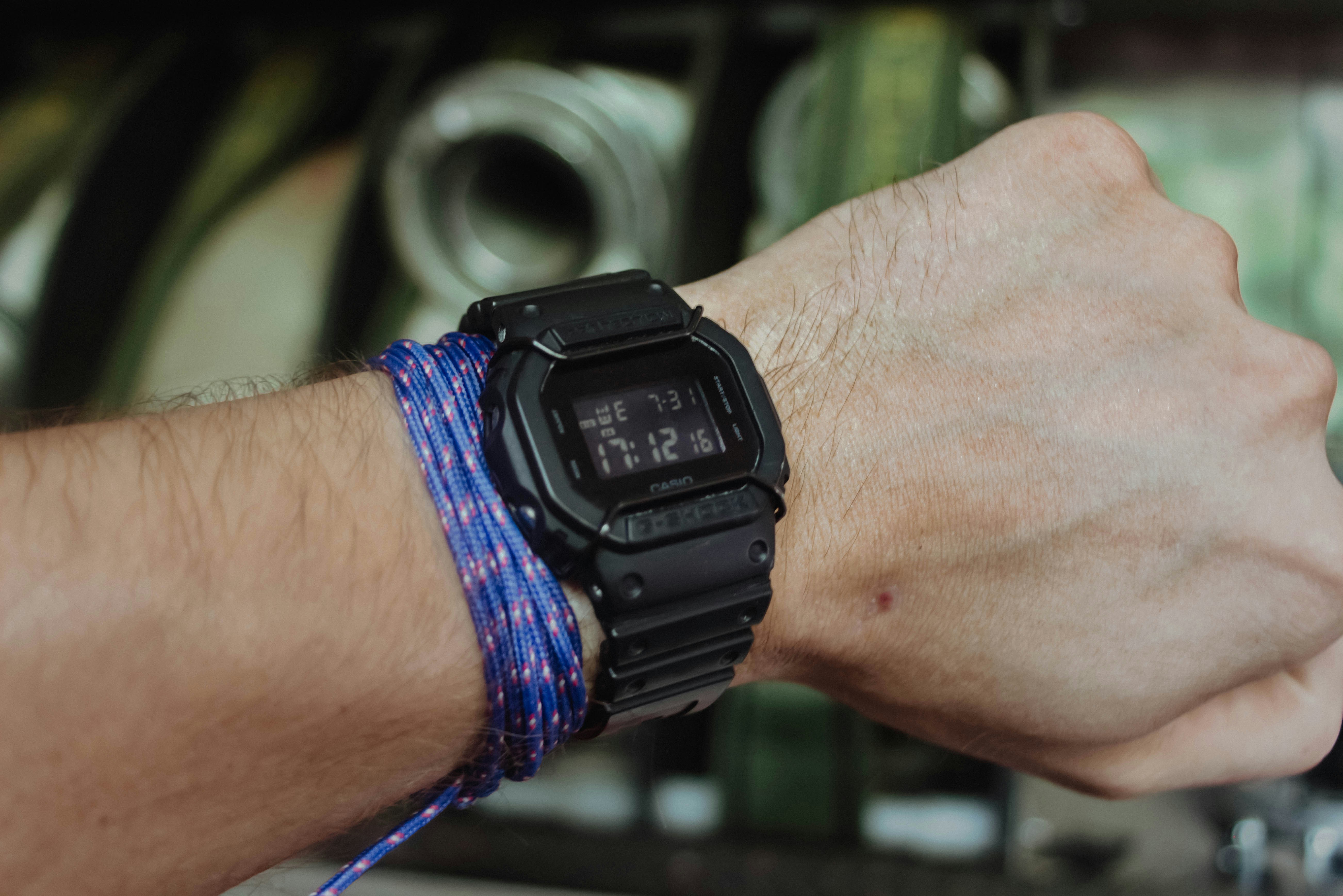 Timekeeper at Rest: A Rugged Digital Watch Framed by a Woven Wrist