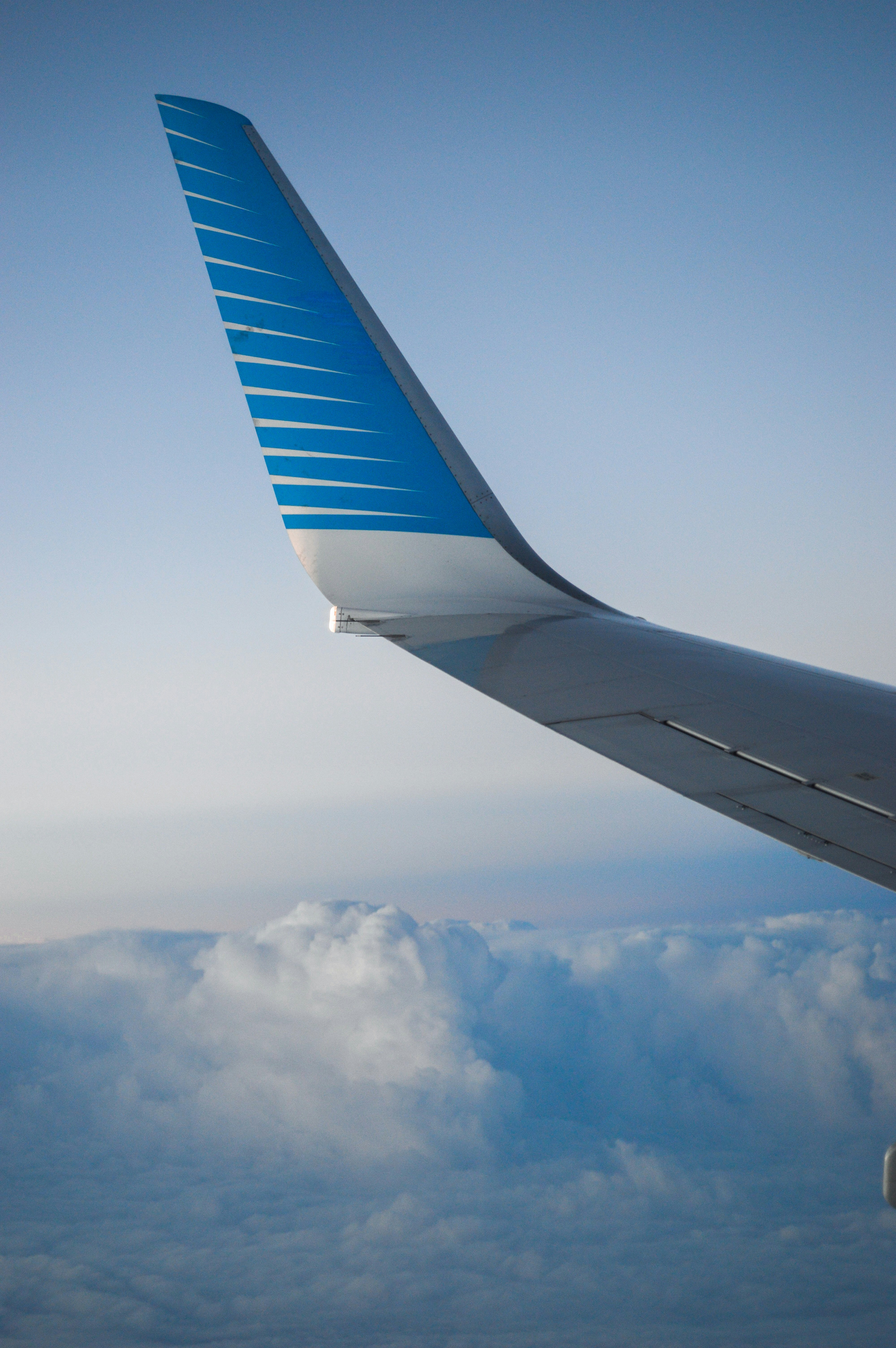 Winglet Above the Stratus: A Quiet Moment Over Clouds