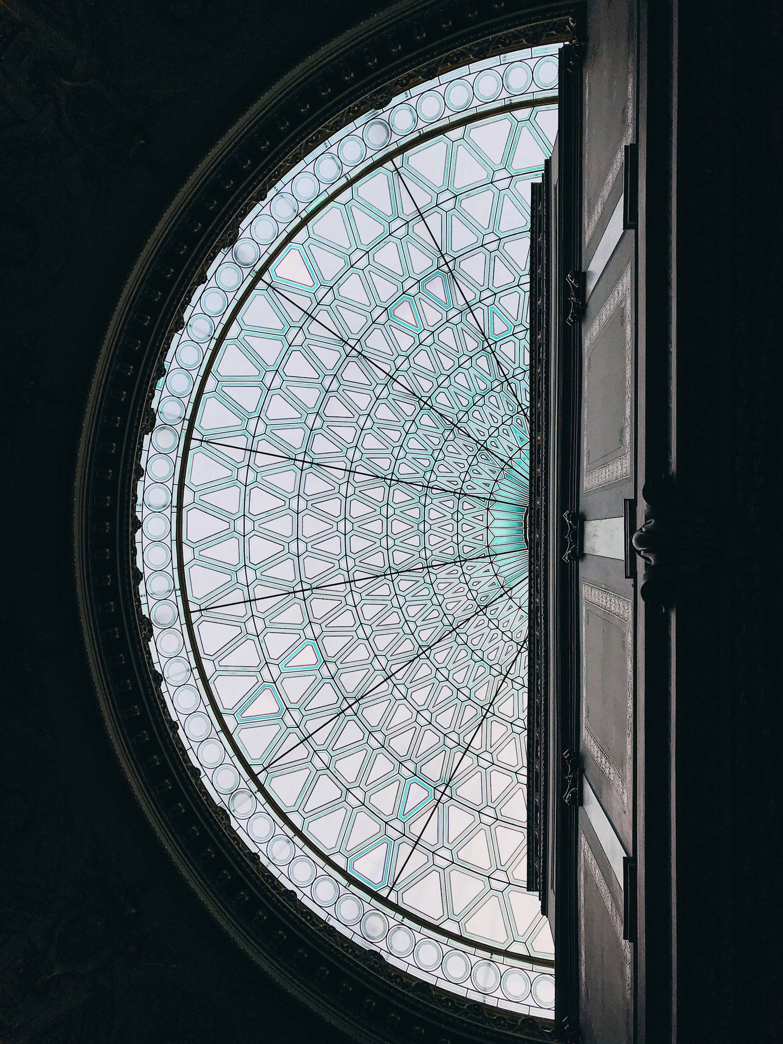 A circular window with a skylight in the middle of it photo – Free Grey ...