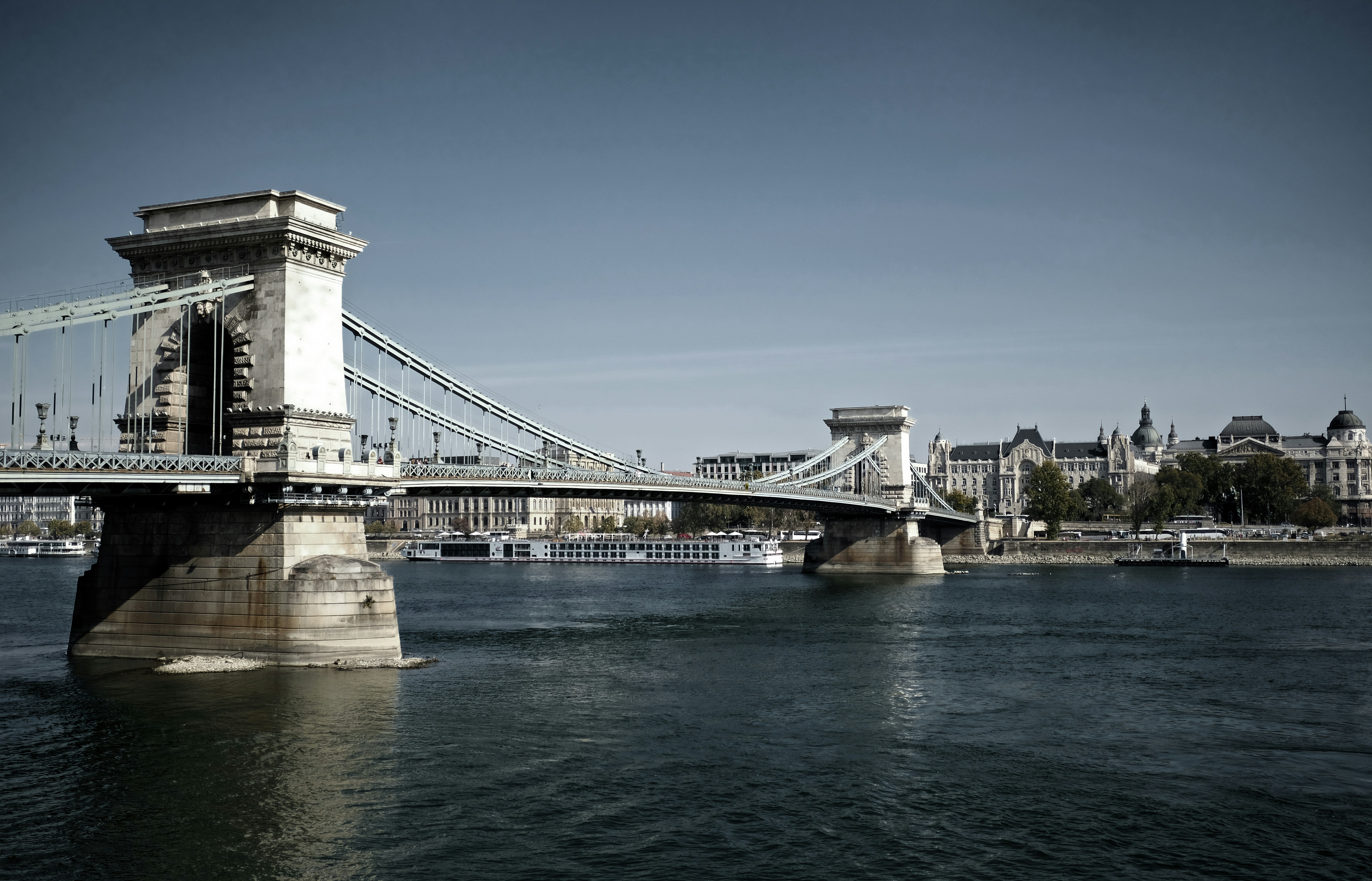 Chain Bridge spanning the Danube River with historic Budapest architecture in the background.