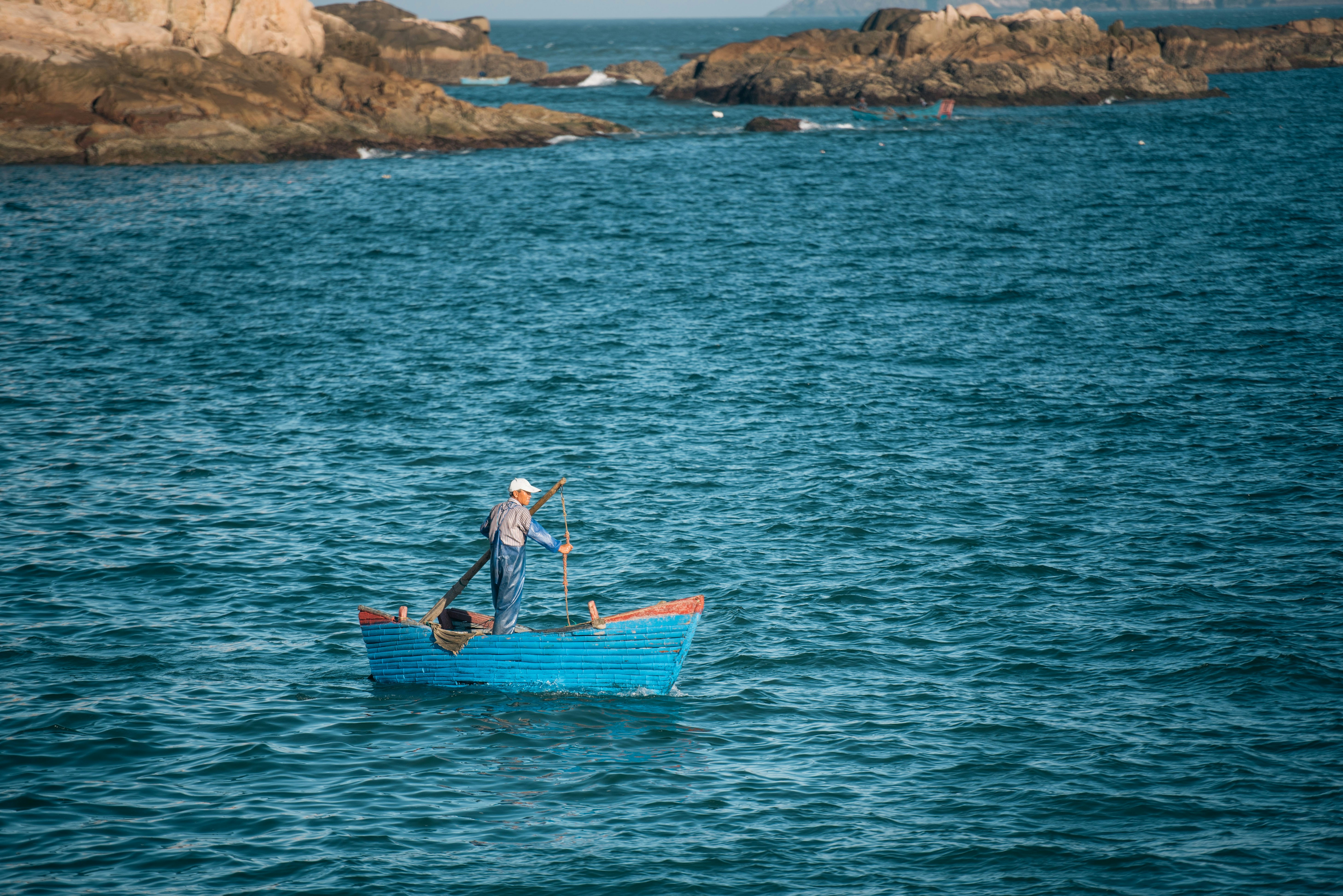 Person riding boat on body of water during daytime photo – Free Blue ...