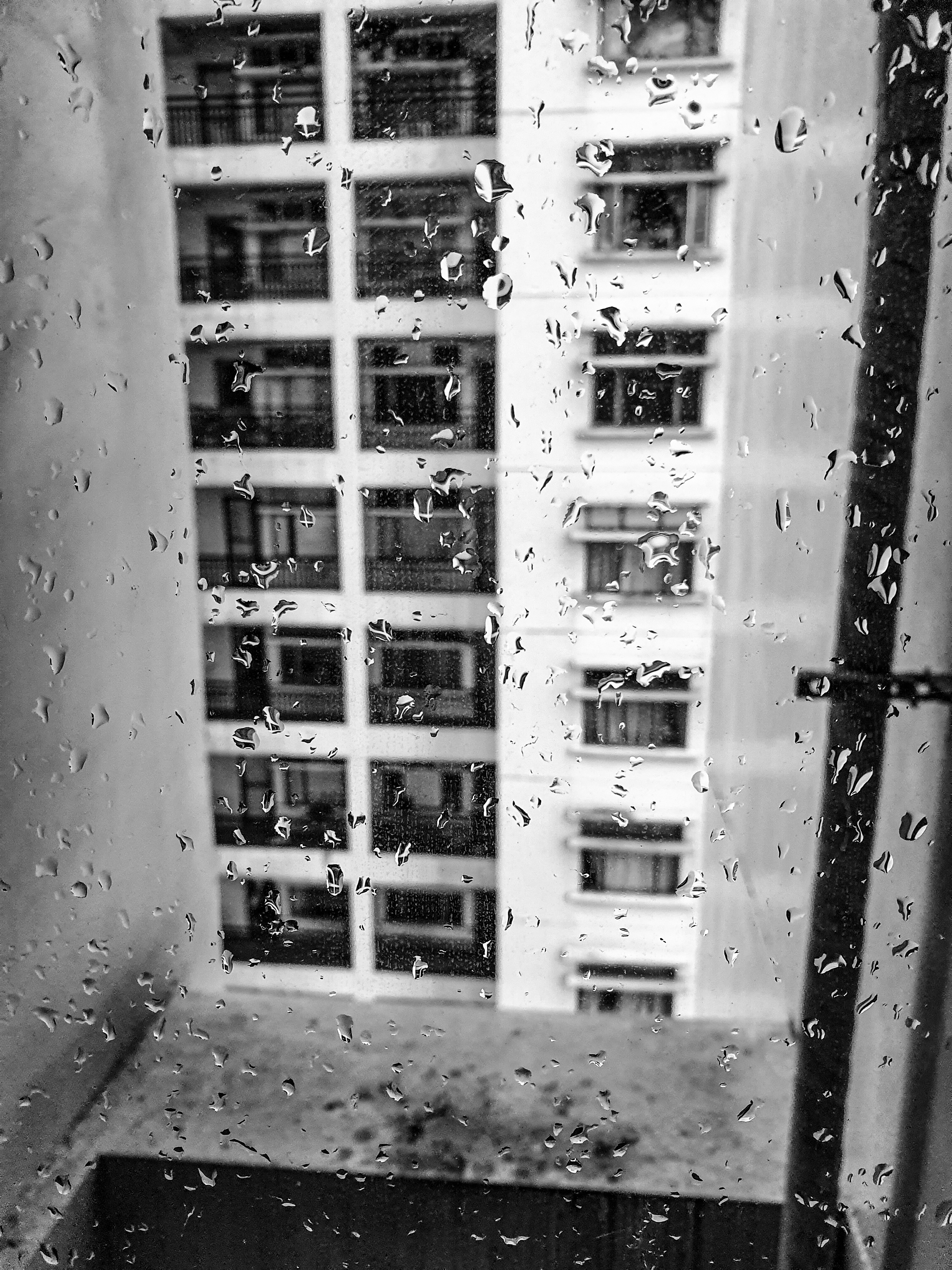 Rain-soaked Window to a City Grid