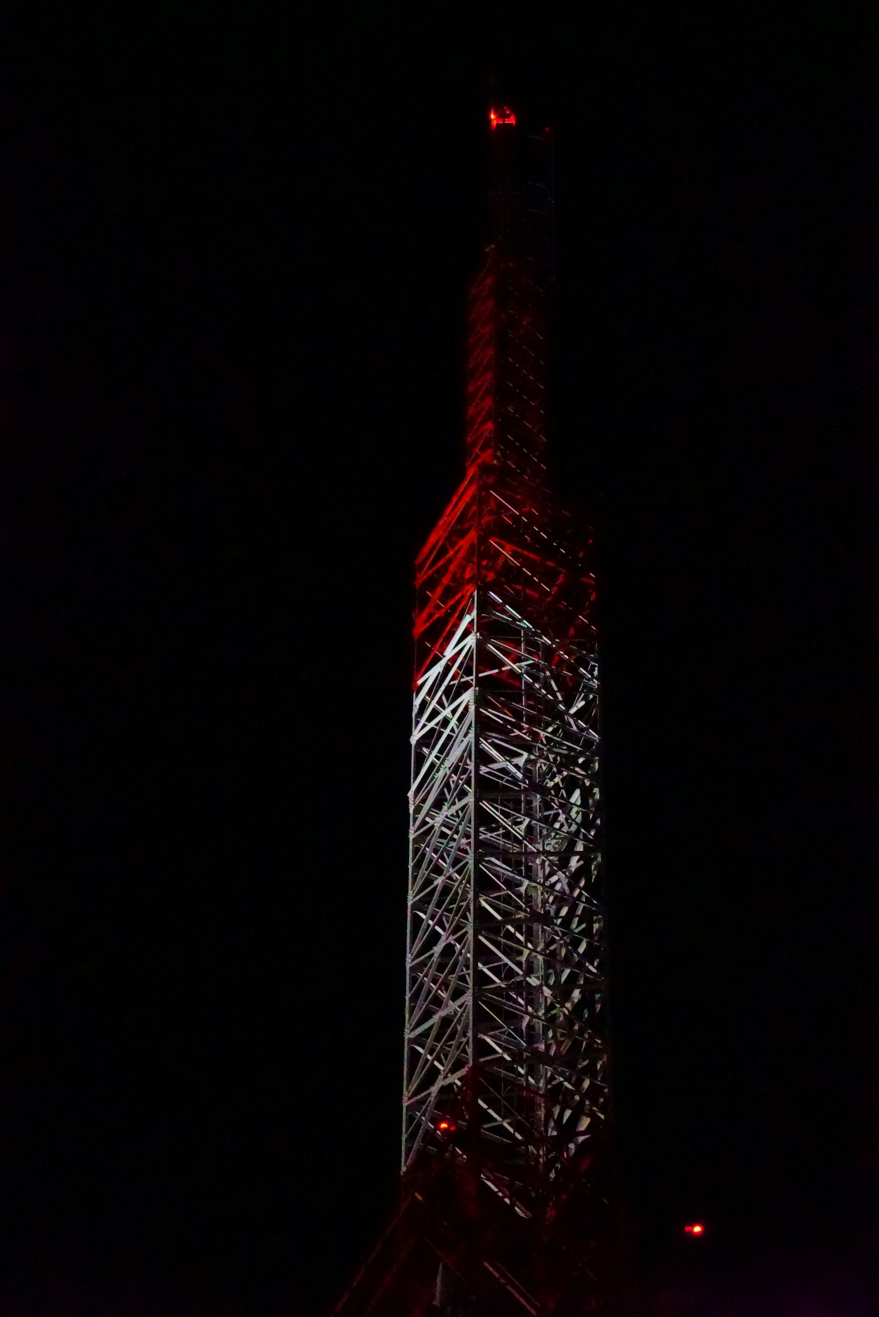 red and white signal tower