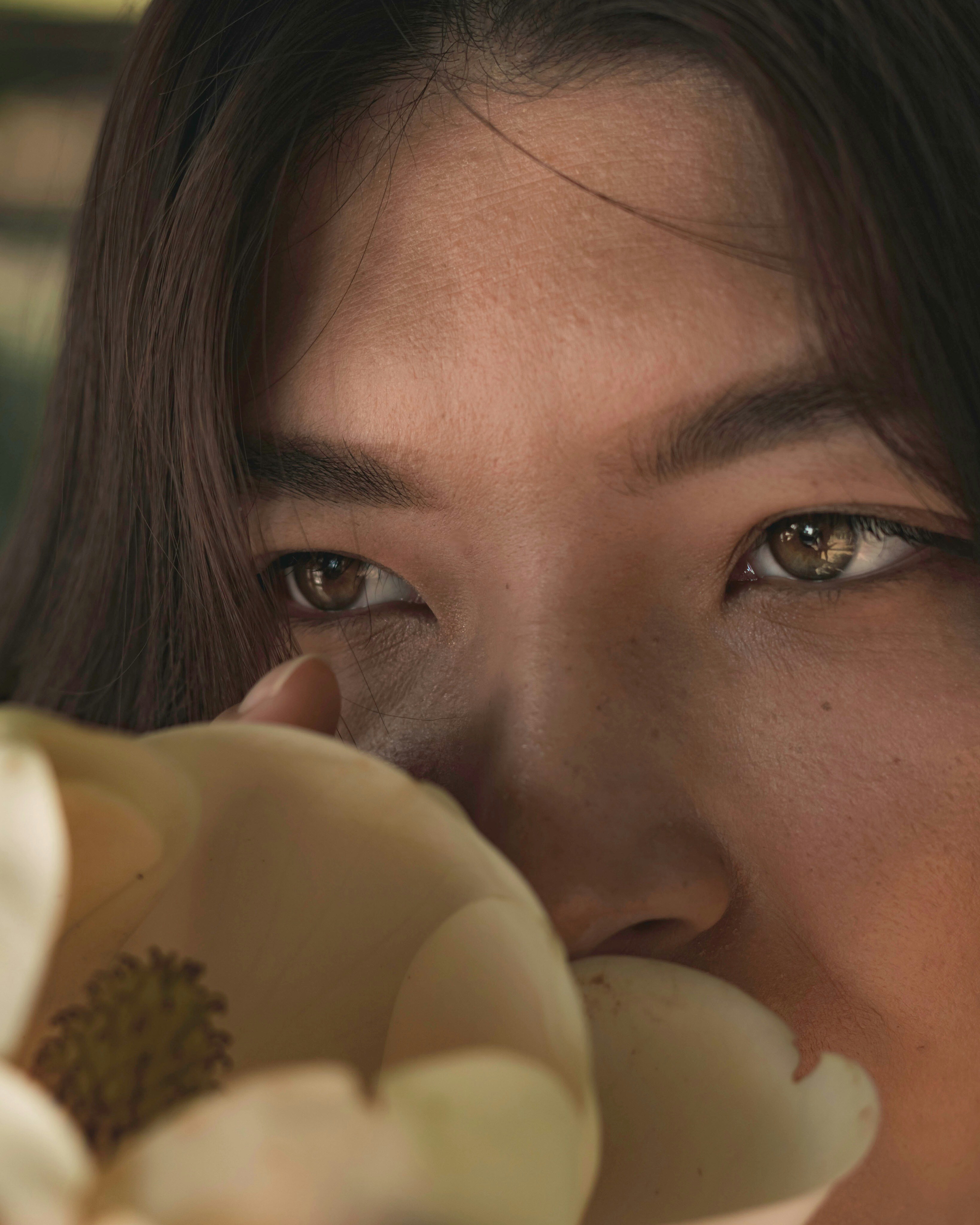 Eyes Meet Petal Glow: A Subtle Portrait with Soft Floral Hint