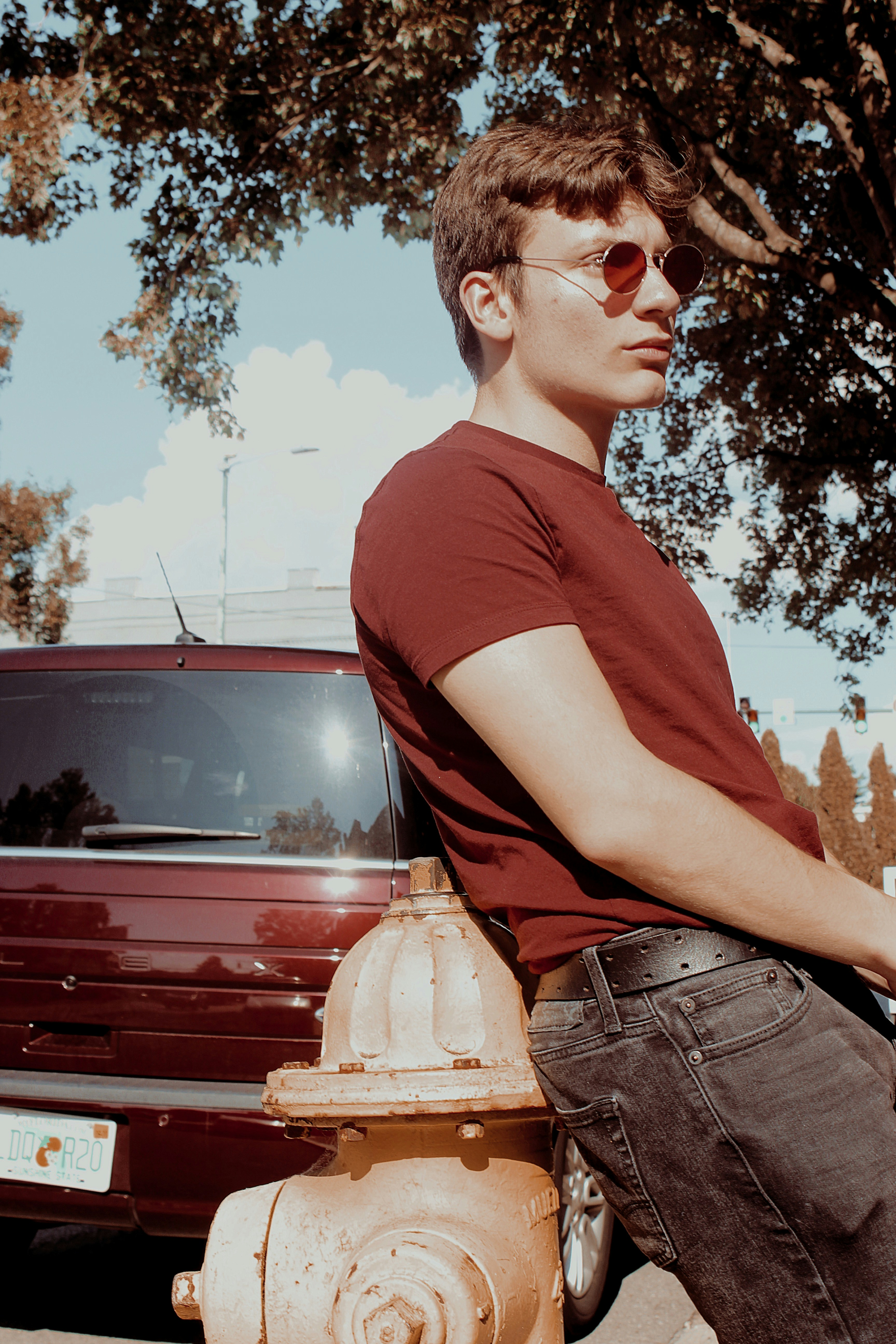A man standing next to a fire hydrant photo – Free Human Image on Unsplash