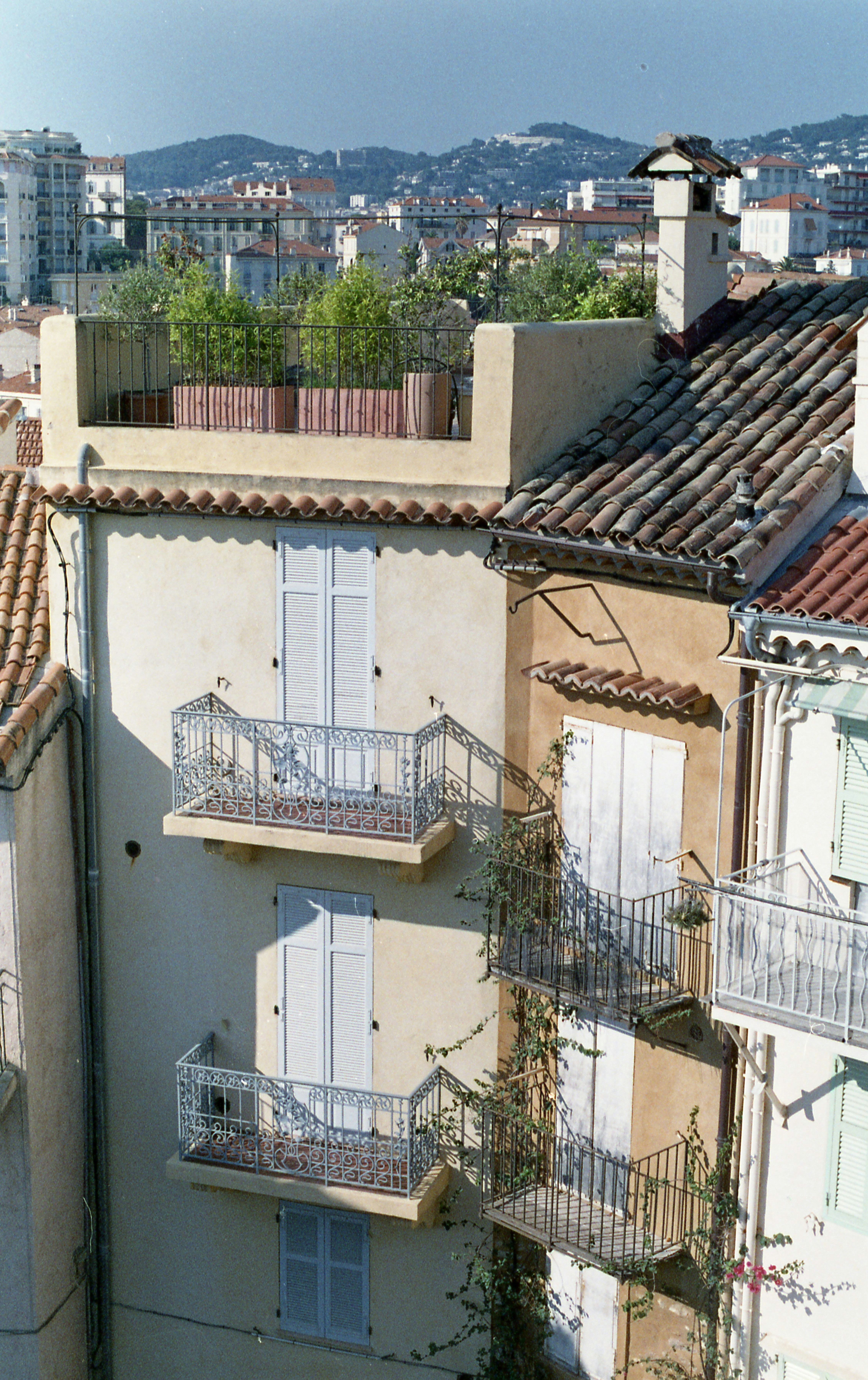 Terracotta Facades and Wrought-Iron Balconies: A Mediterranean Rooftop Portrait