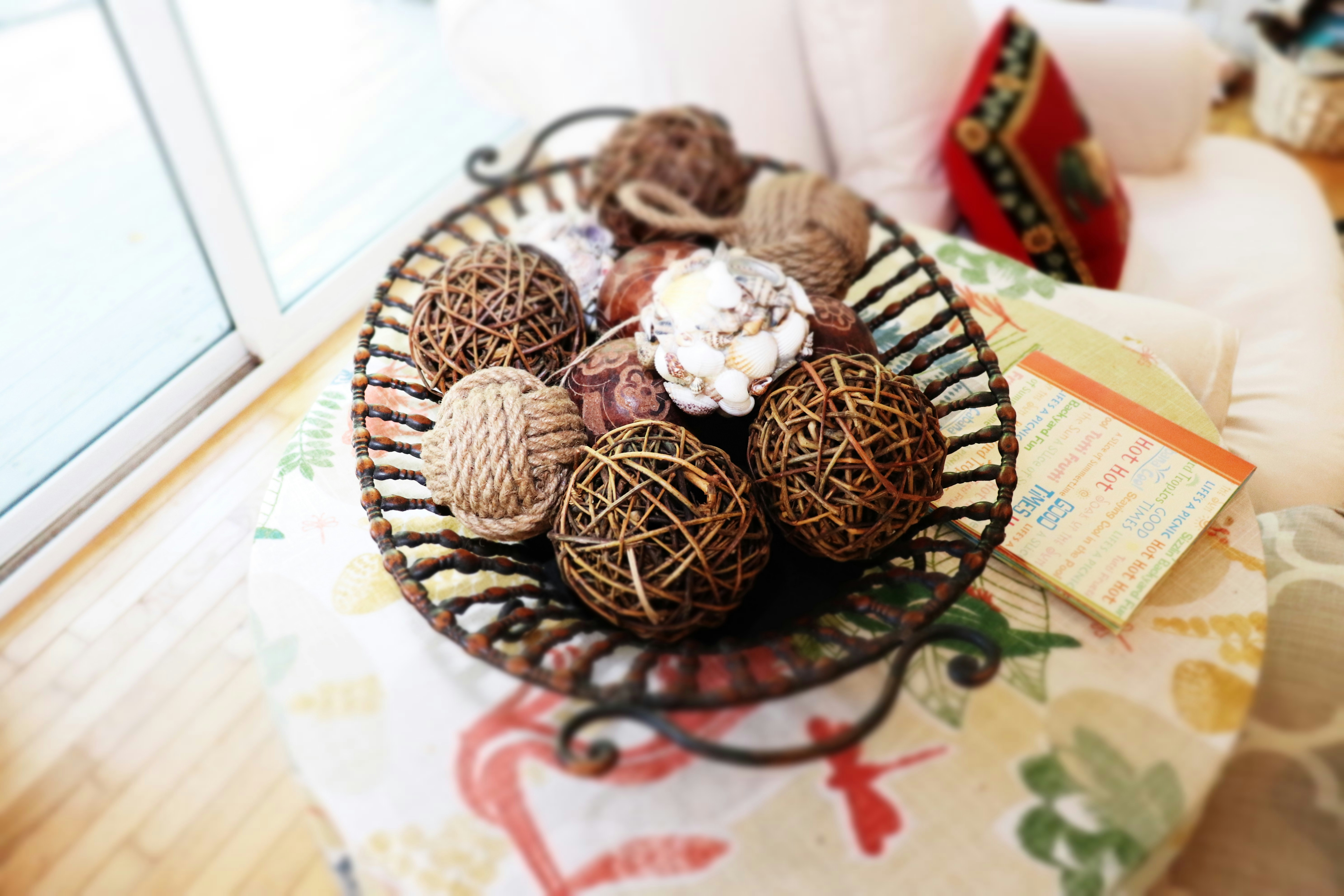 Basket of Rustic Orbs on a Sunlit Table
