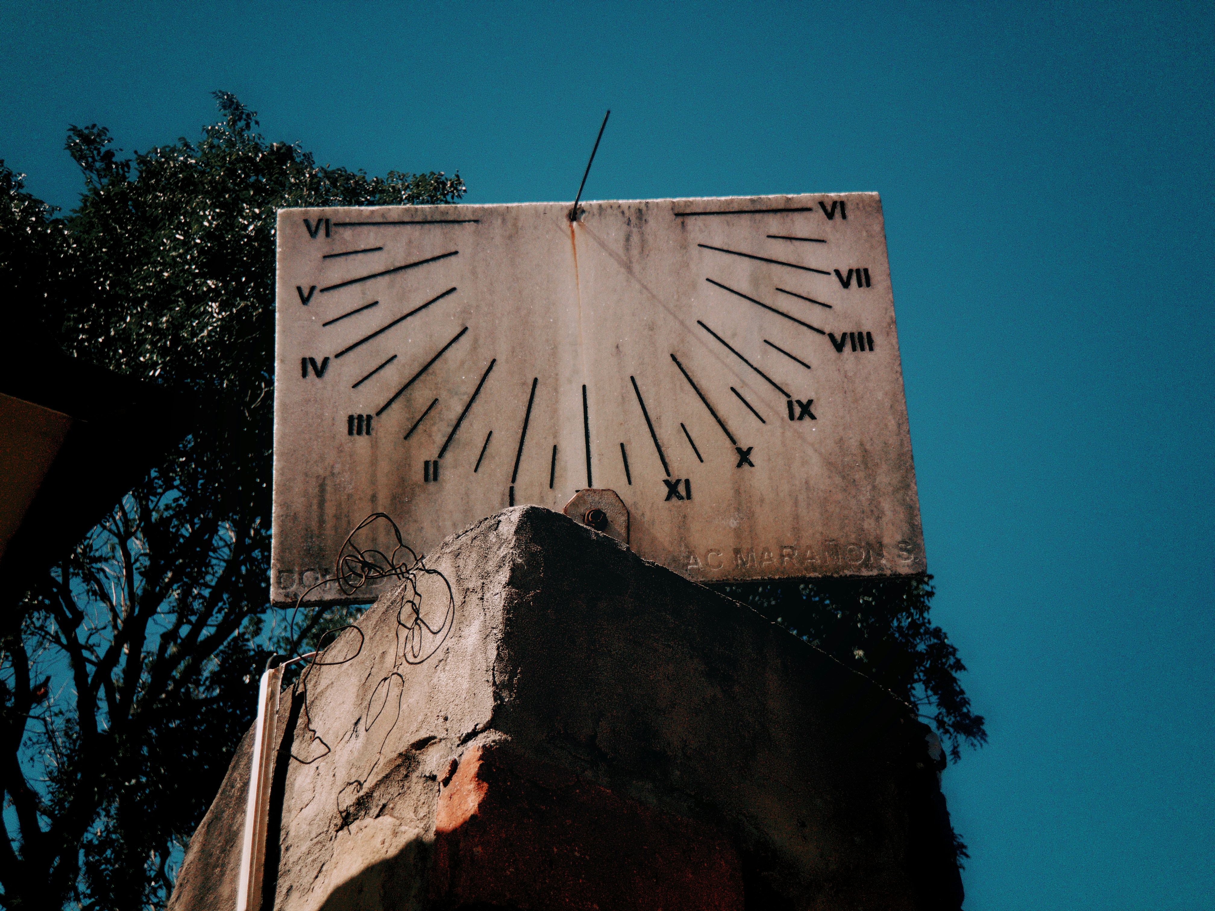 Shadowed Dial: An Ancient Sundial Above a Weathered Pedestal
