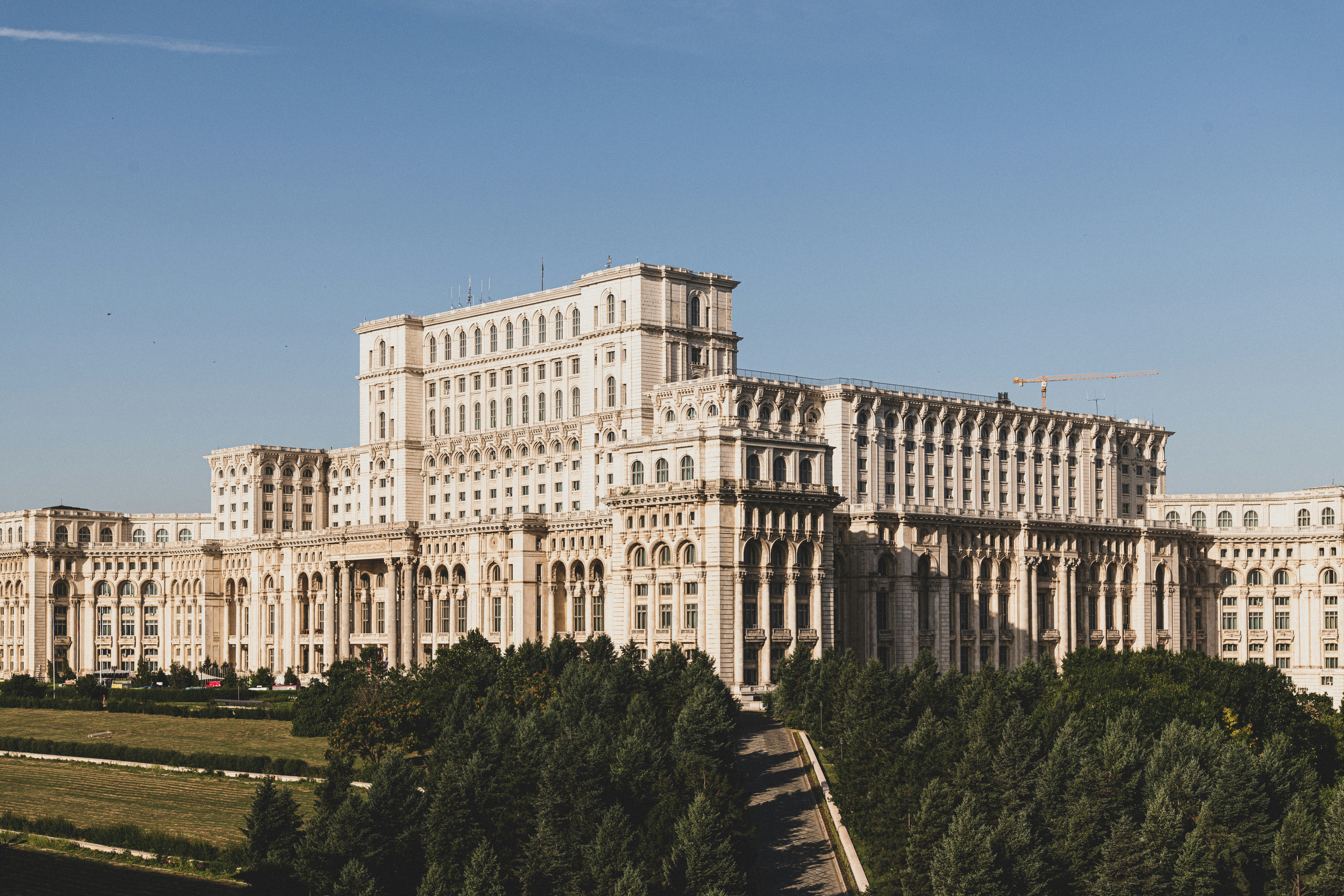 beige building near trees photo – Free Grey Image on Unsplash