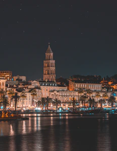 Moonlit Belfry Over a Palm-Streaked Waterfront