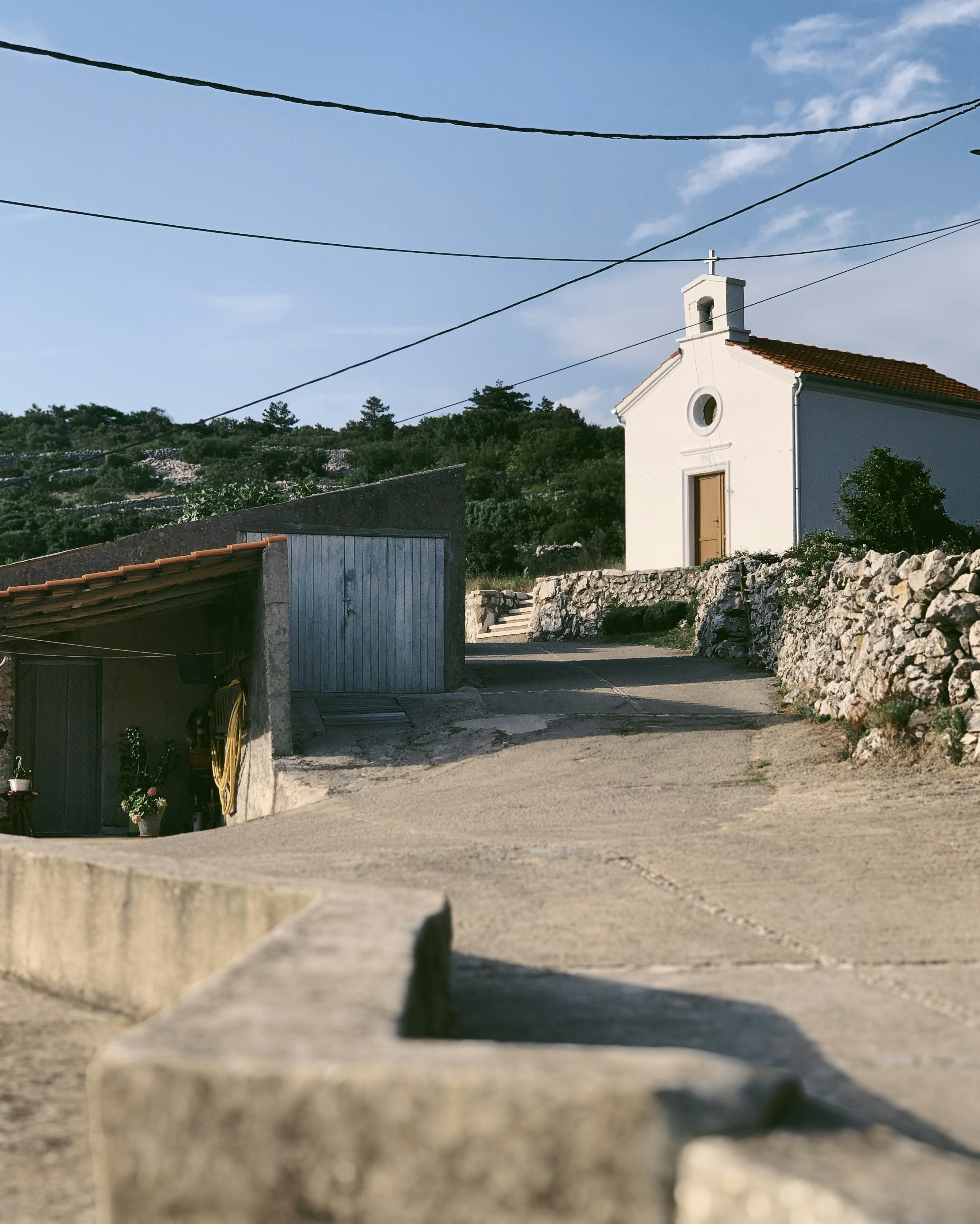 White Chapel at the End of a Winding Stone Path