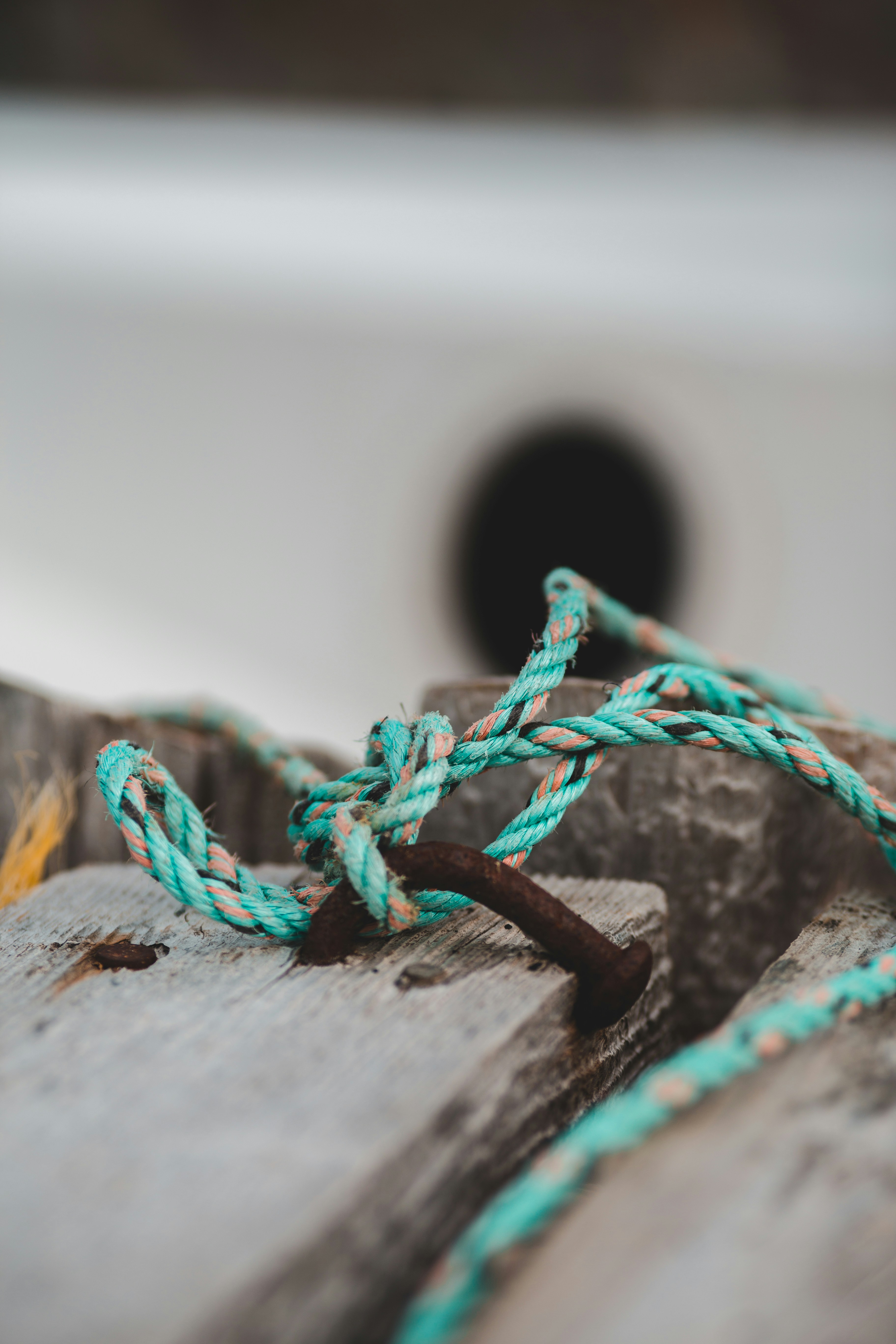Azure Knot on Weathered Wood: Maritime Detail in Focus