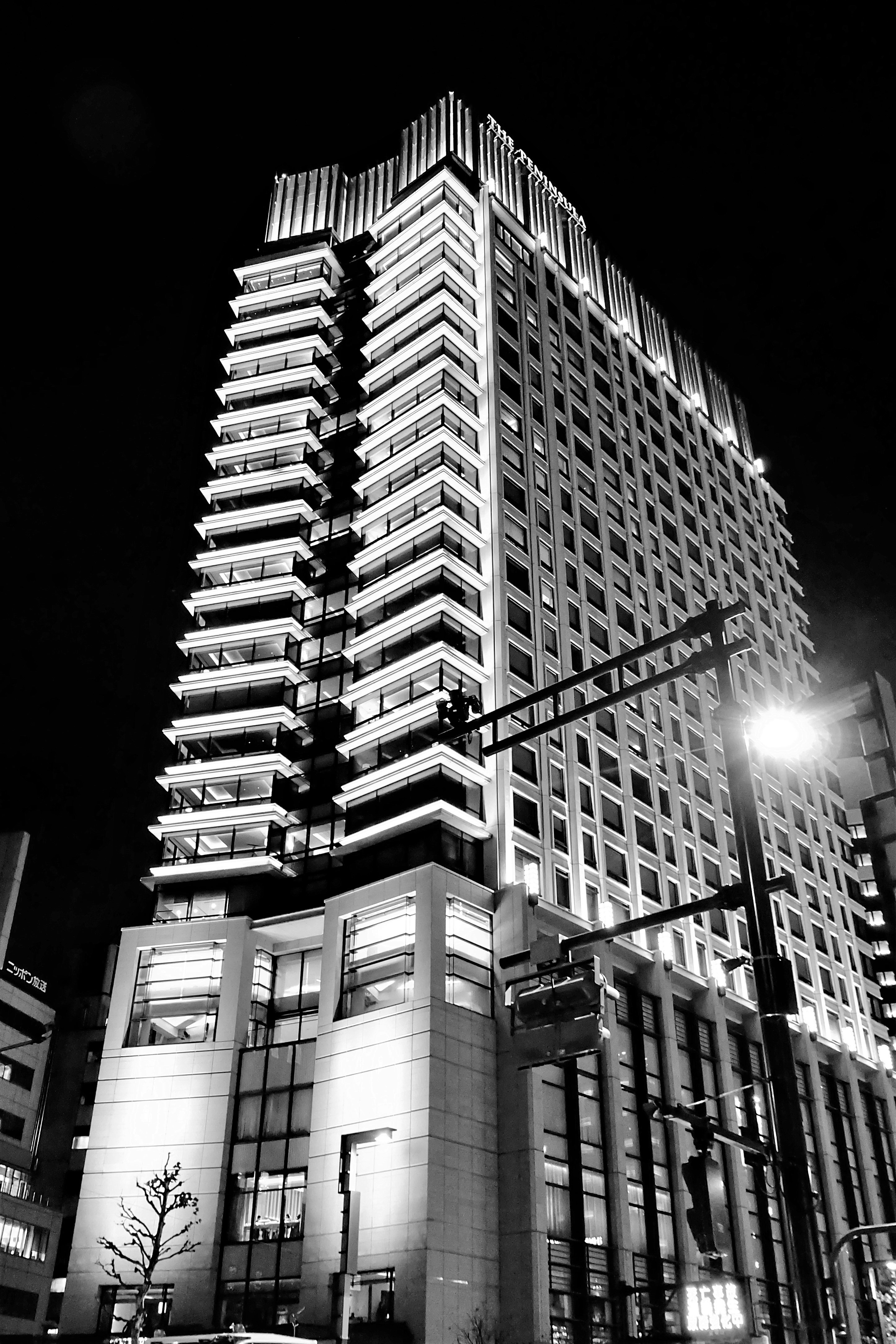 Neon Crown: A Night Portrait of a Tall Clerestory-ed Building