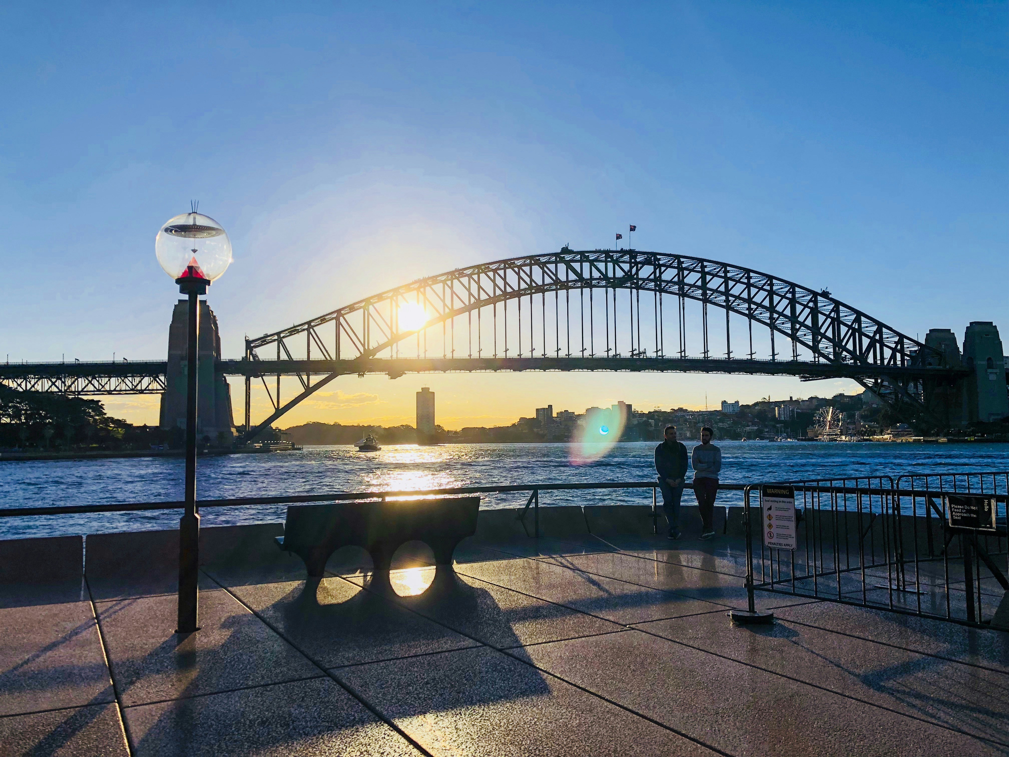 Sunlit Sydney Spark: The Harbour Bridge at Dusk