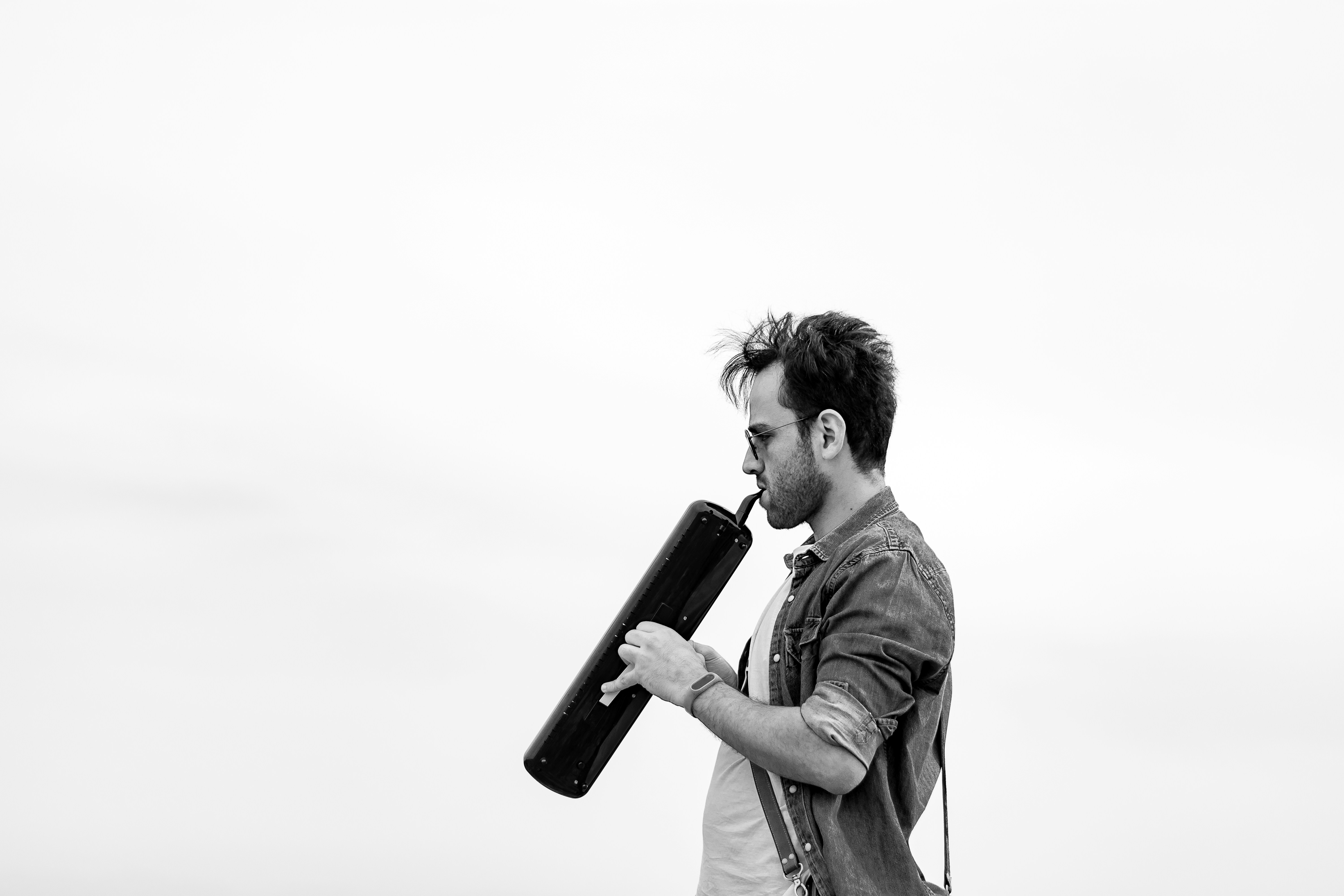 Lone Messenger: A Portrait with a Casement Instrument Against an Empty Sky