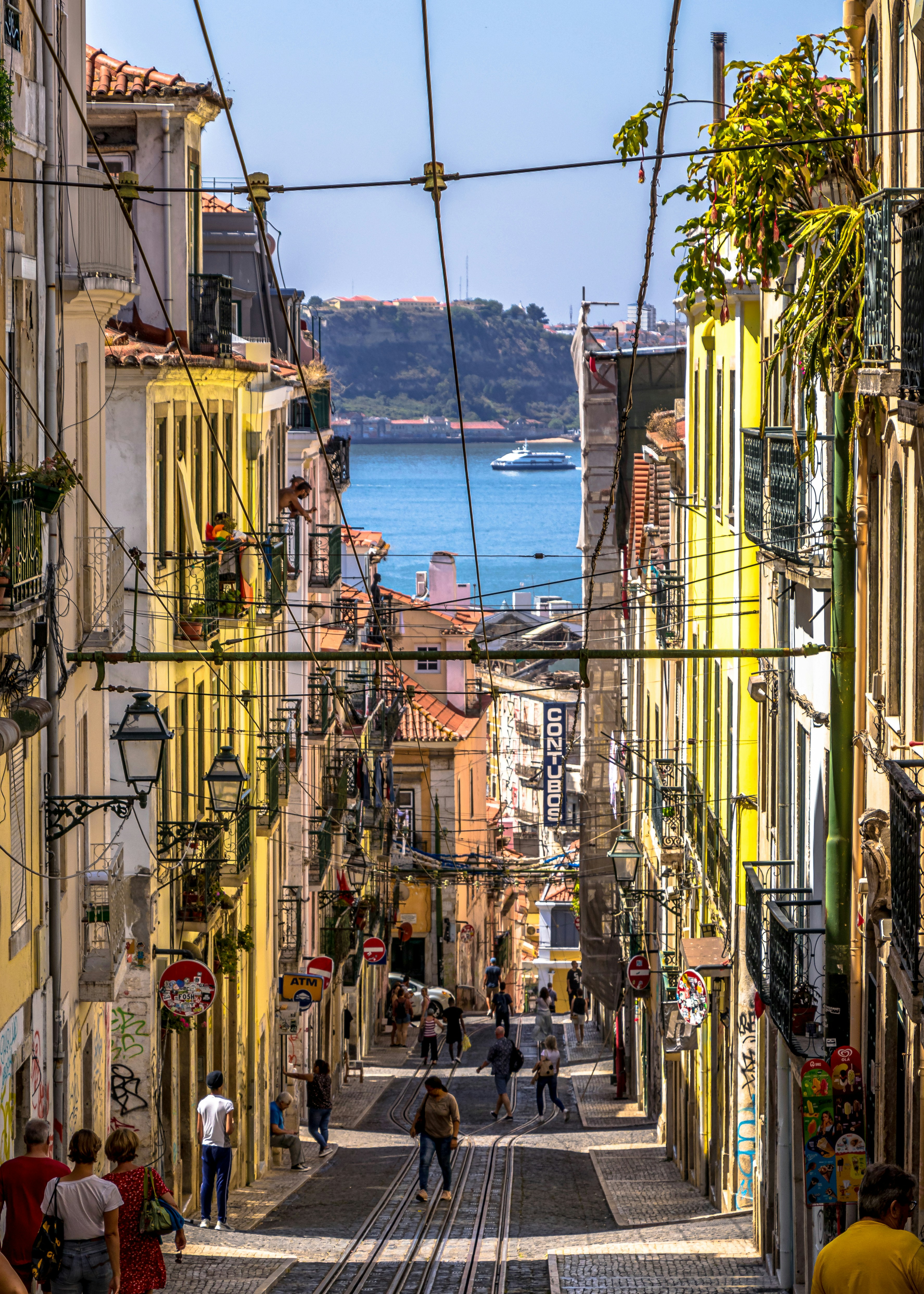 Sunlit Alley to the Sea: A Portuguese Street Painted with Light