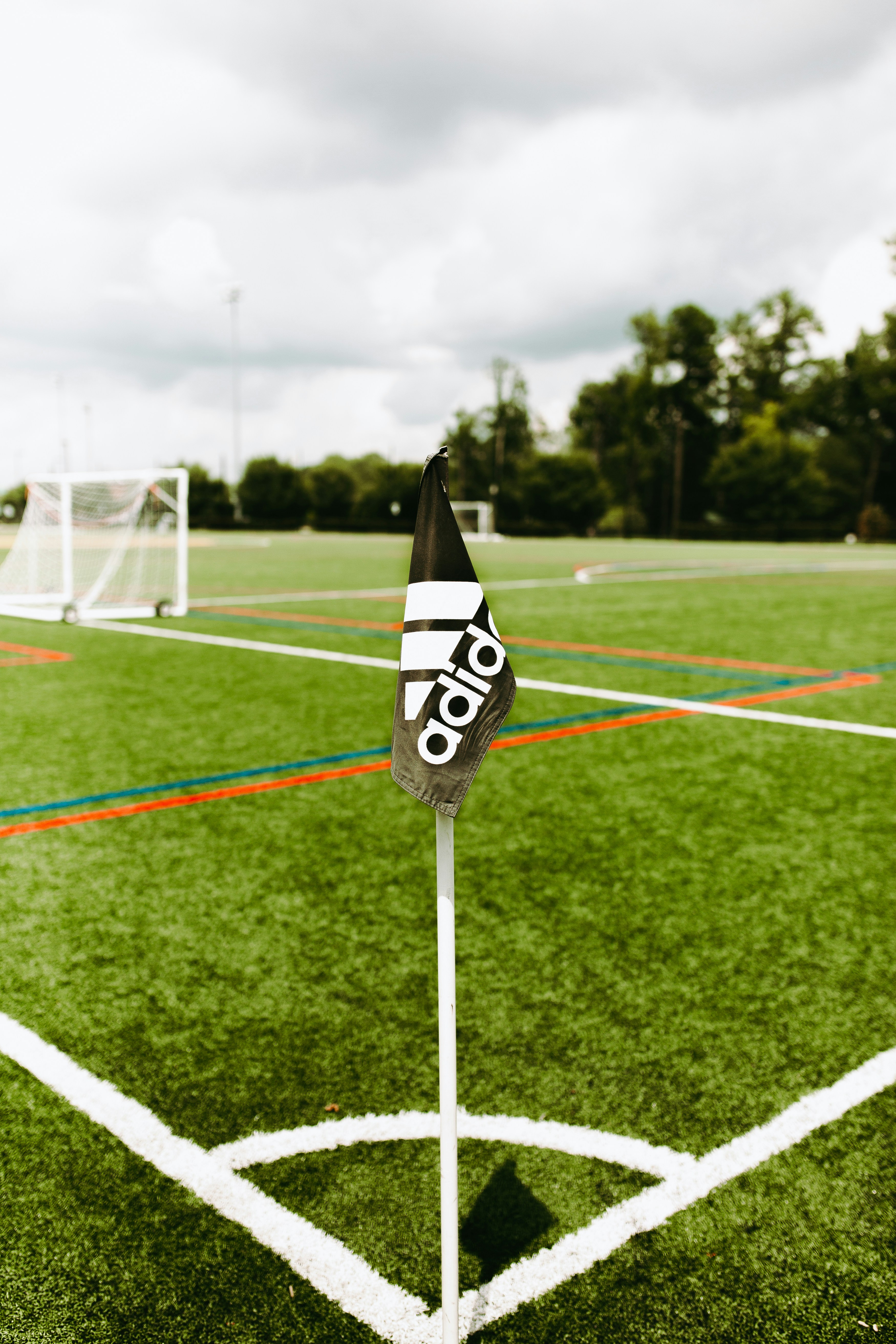 Adidas flag on pole on soccer field photo – Free Building Image on Unsplash