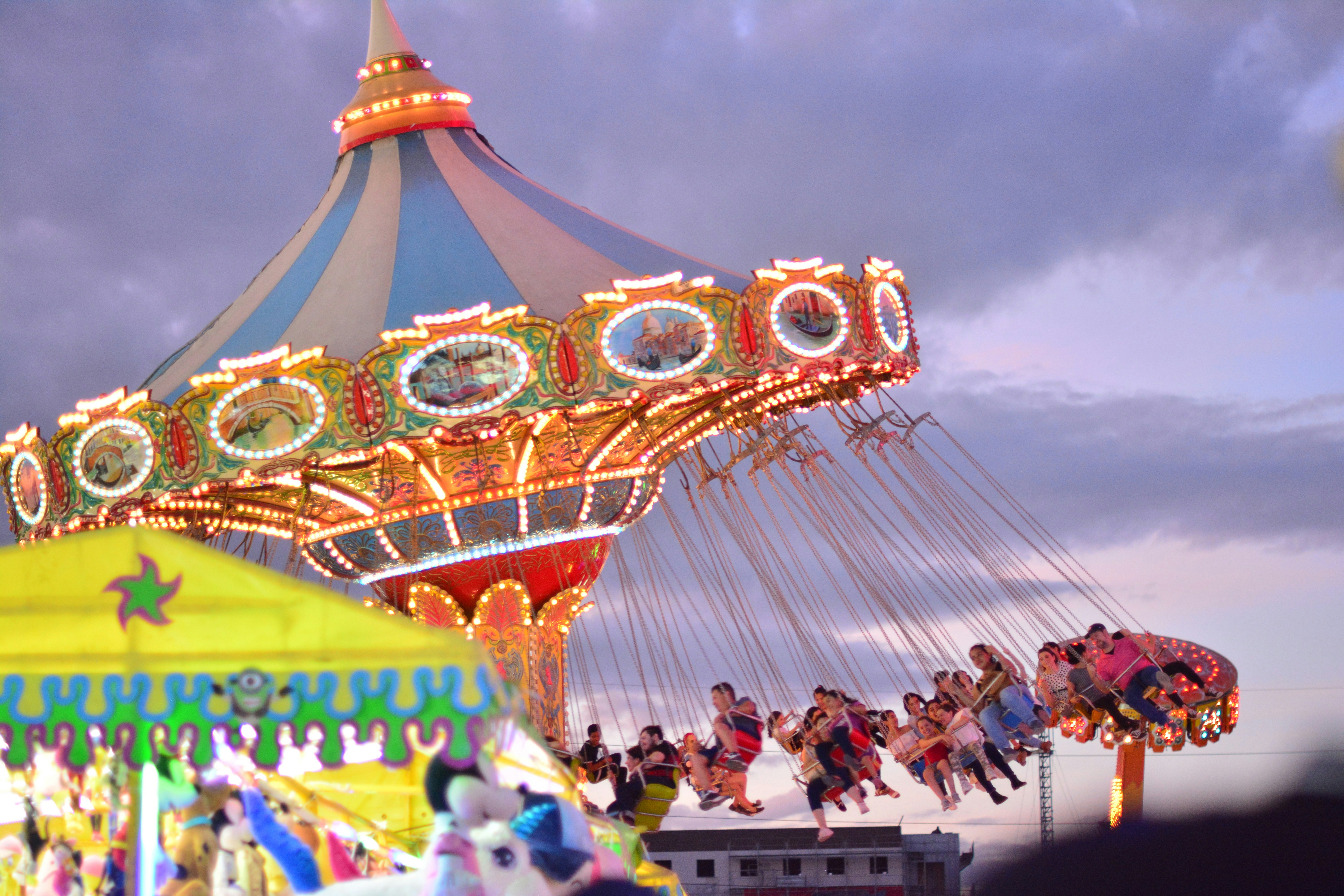 Neon Carousel in Motion: A Night Ride of Light and Swing