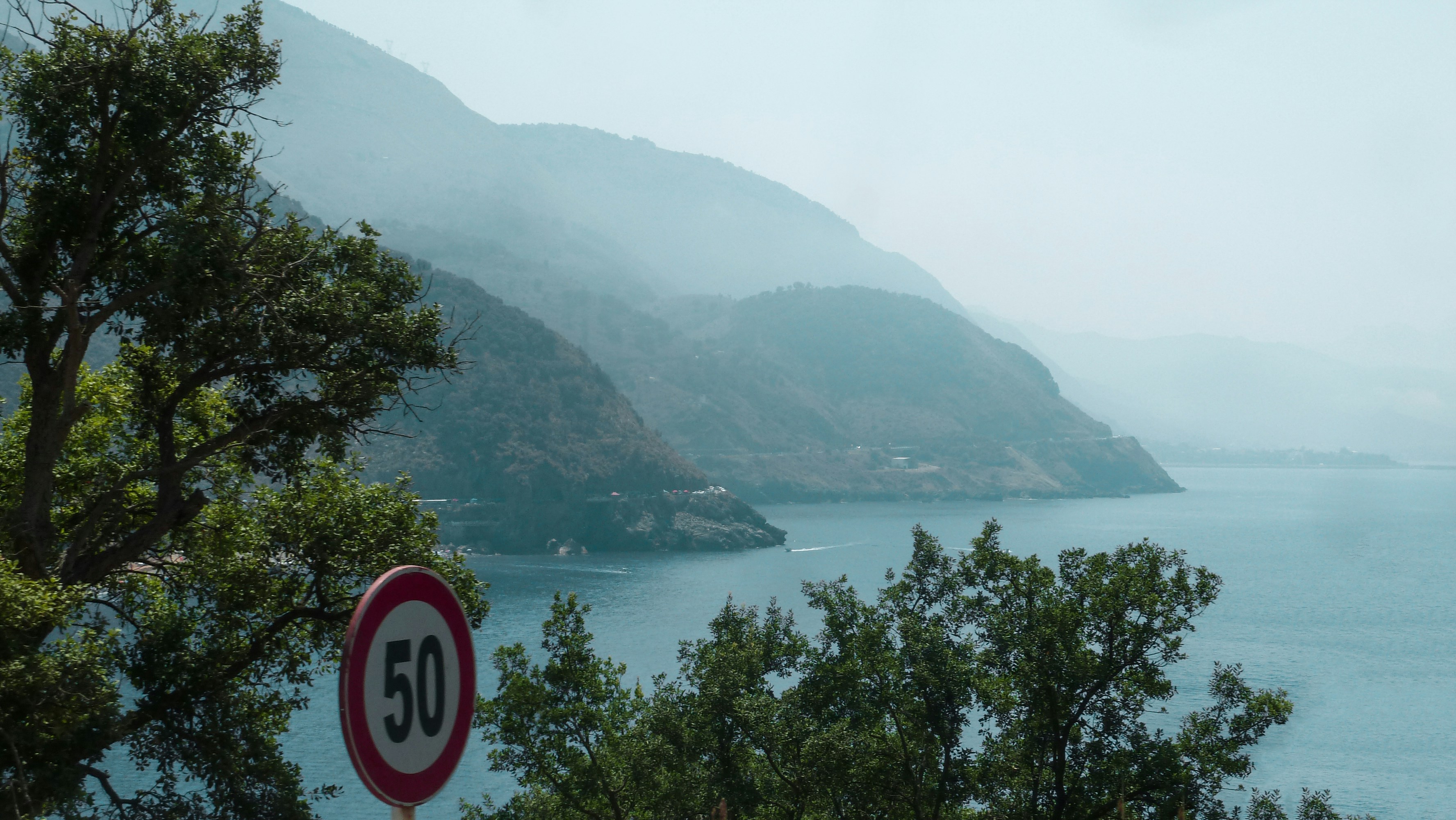 Misty Fjord Vista: A Coastal Corridor Framed by Distant Peaks
