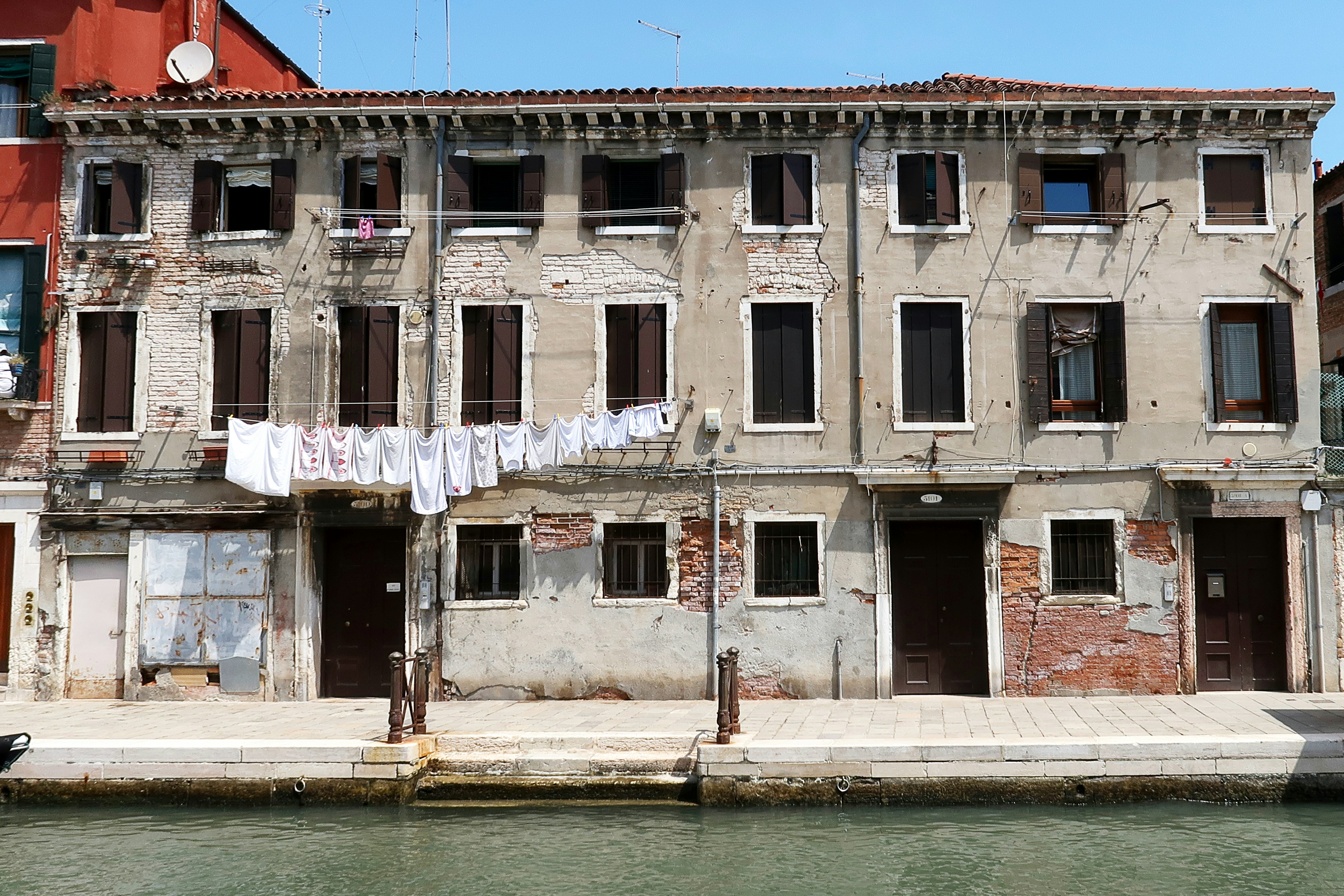 Laundry Lines and Weathered Facades: A Venetian Canal Scene