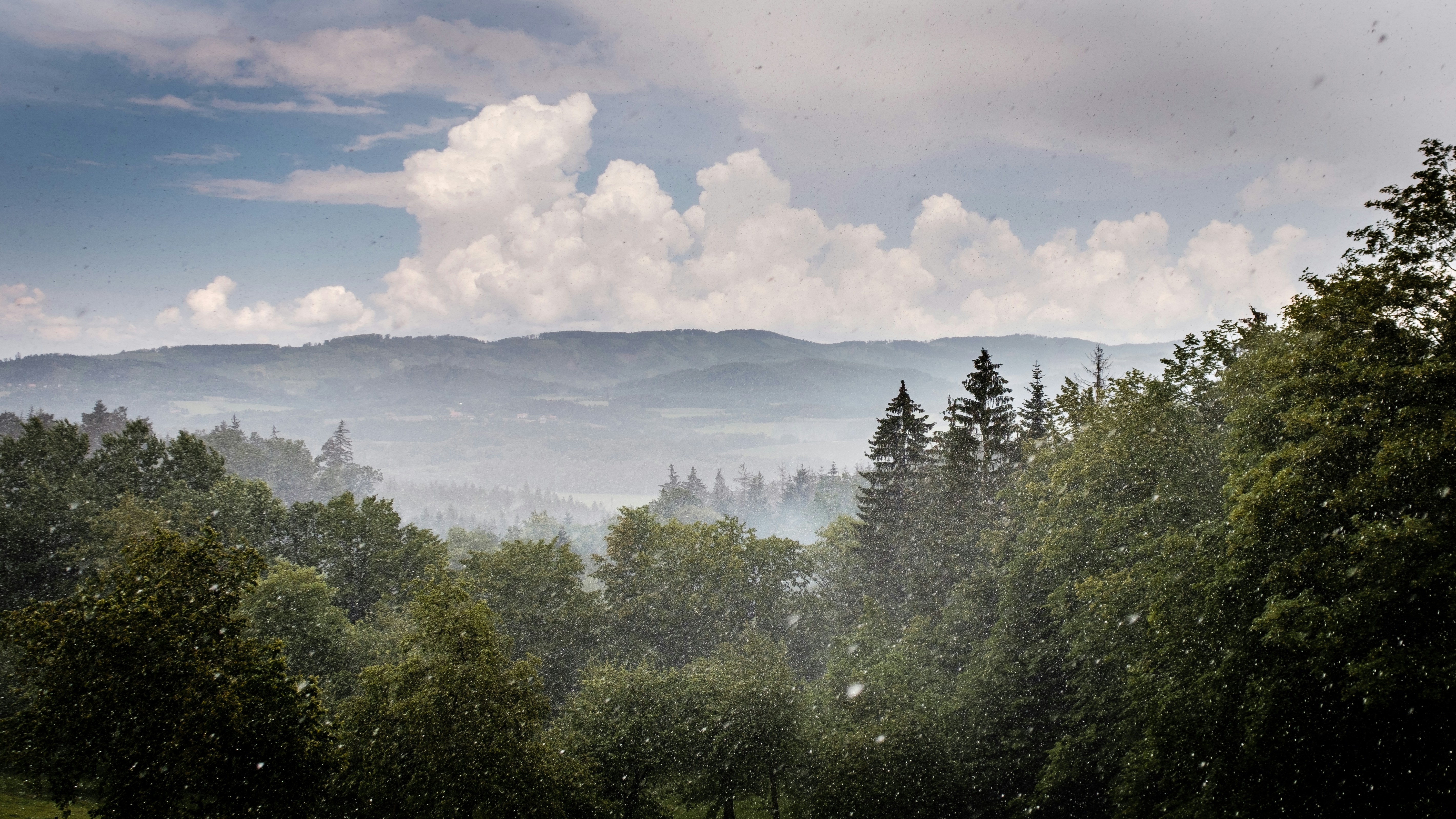 Misty Valley Ridge: Layers of Green under a Quiet Sky