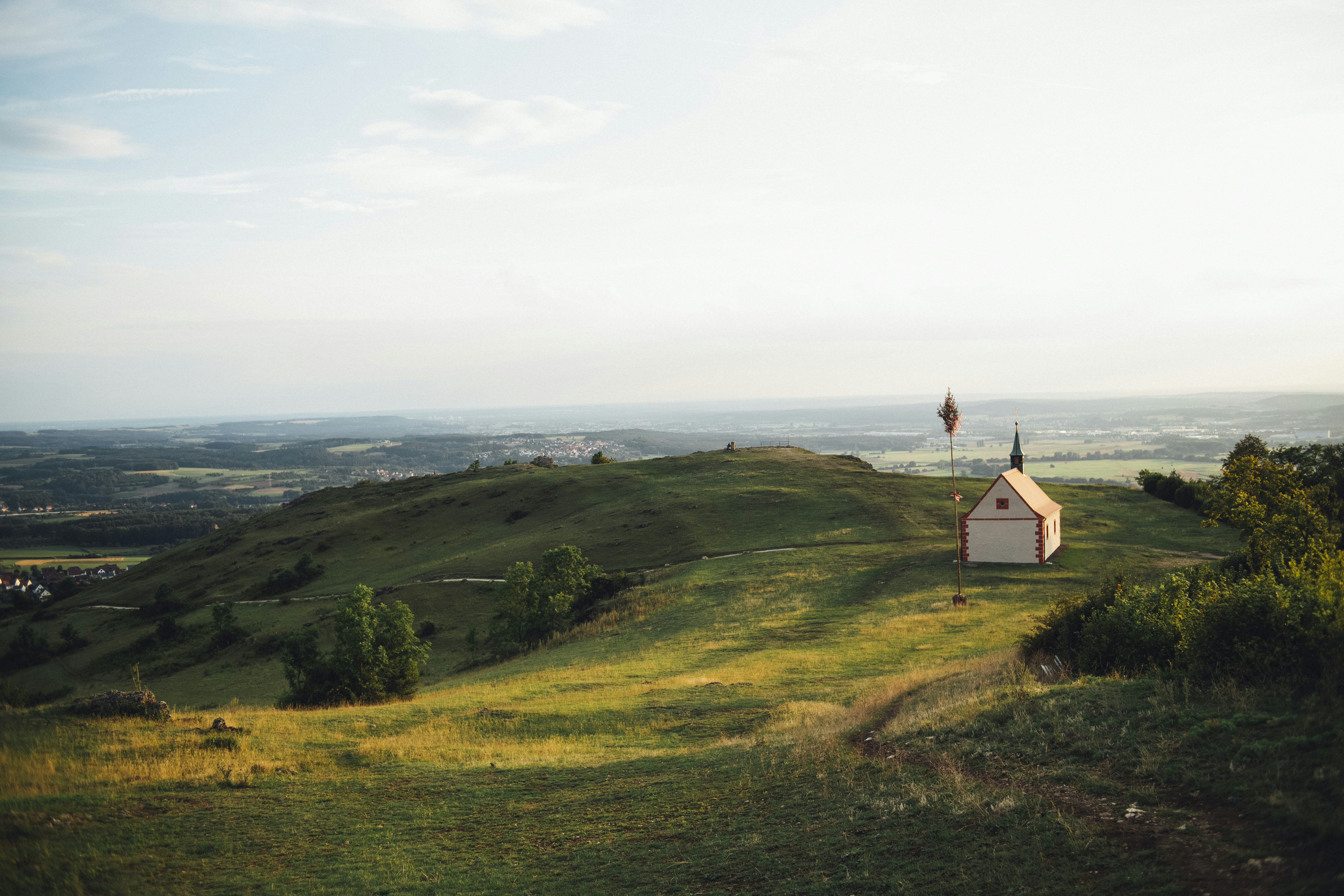 Aerial photography of white building near open field during daytime ...