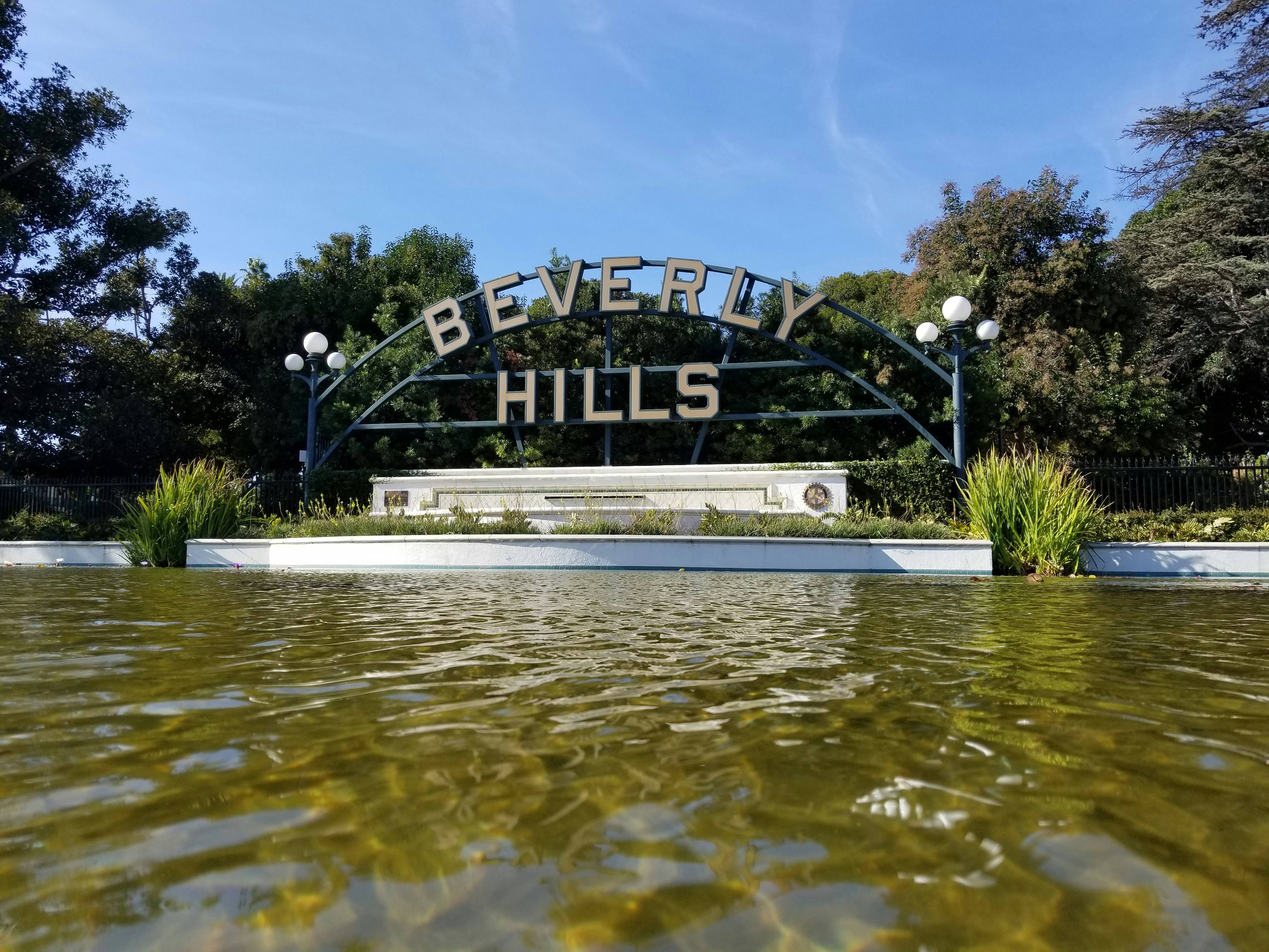 Beverly Hills arch signage near body of water photo – Free Water Image ...