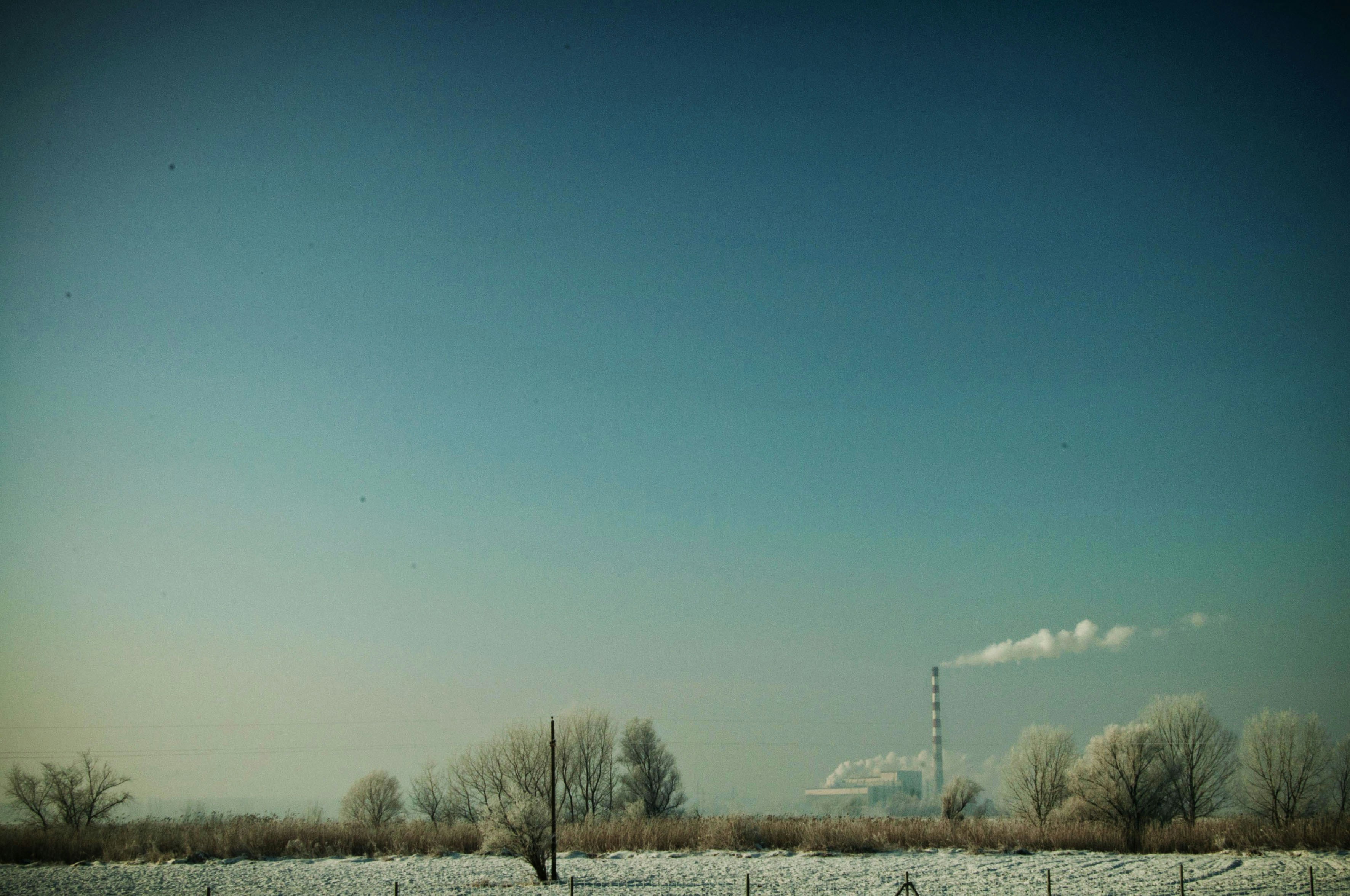 Whispers of Industry in a Frosted Landscape