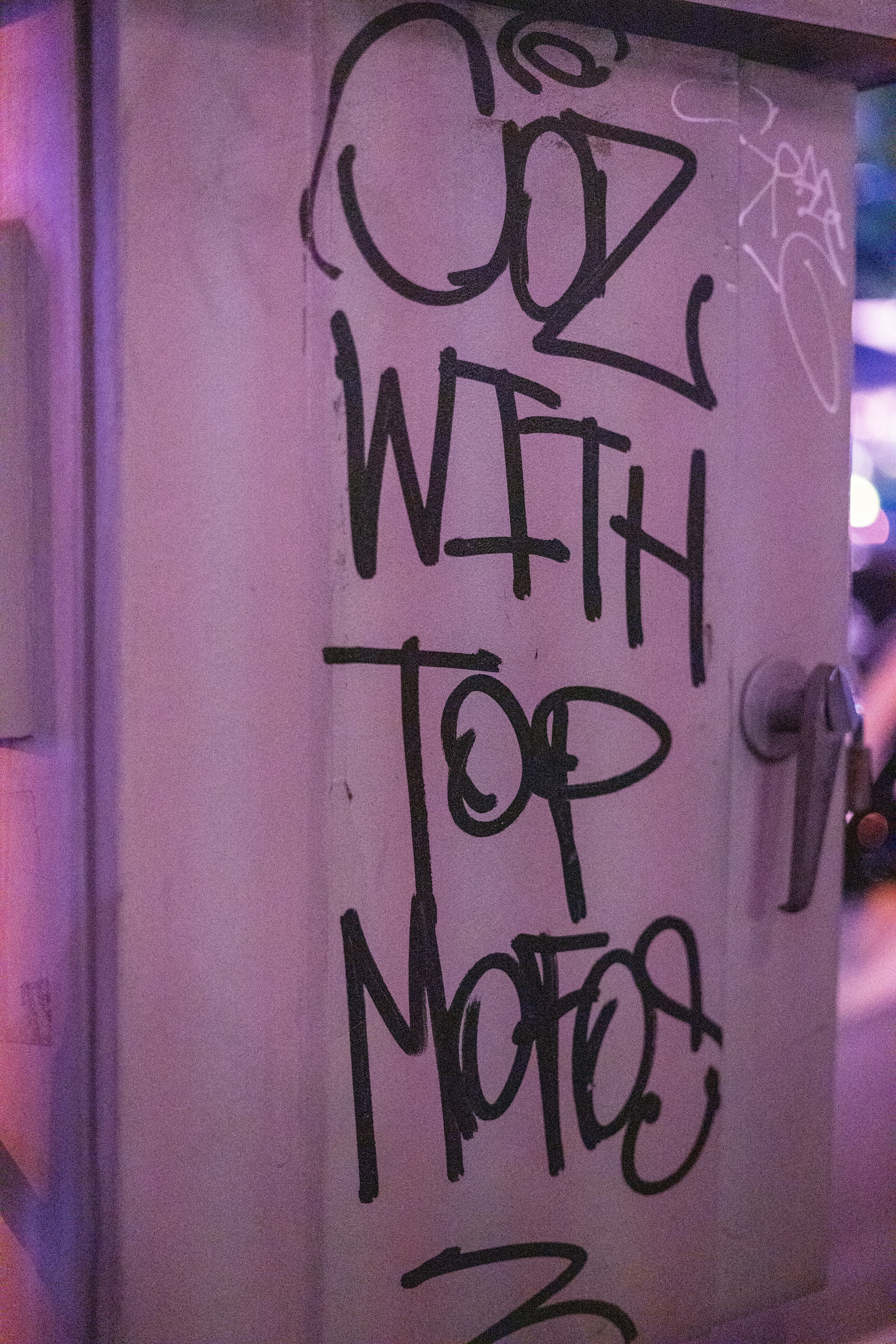 Bold graffiti on a street utility box, showcasing urban artistry with a message. The vibrant colors and dynamic lettering draw attention.