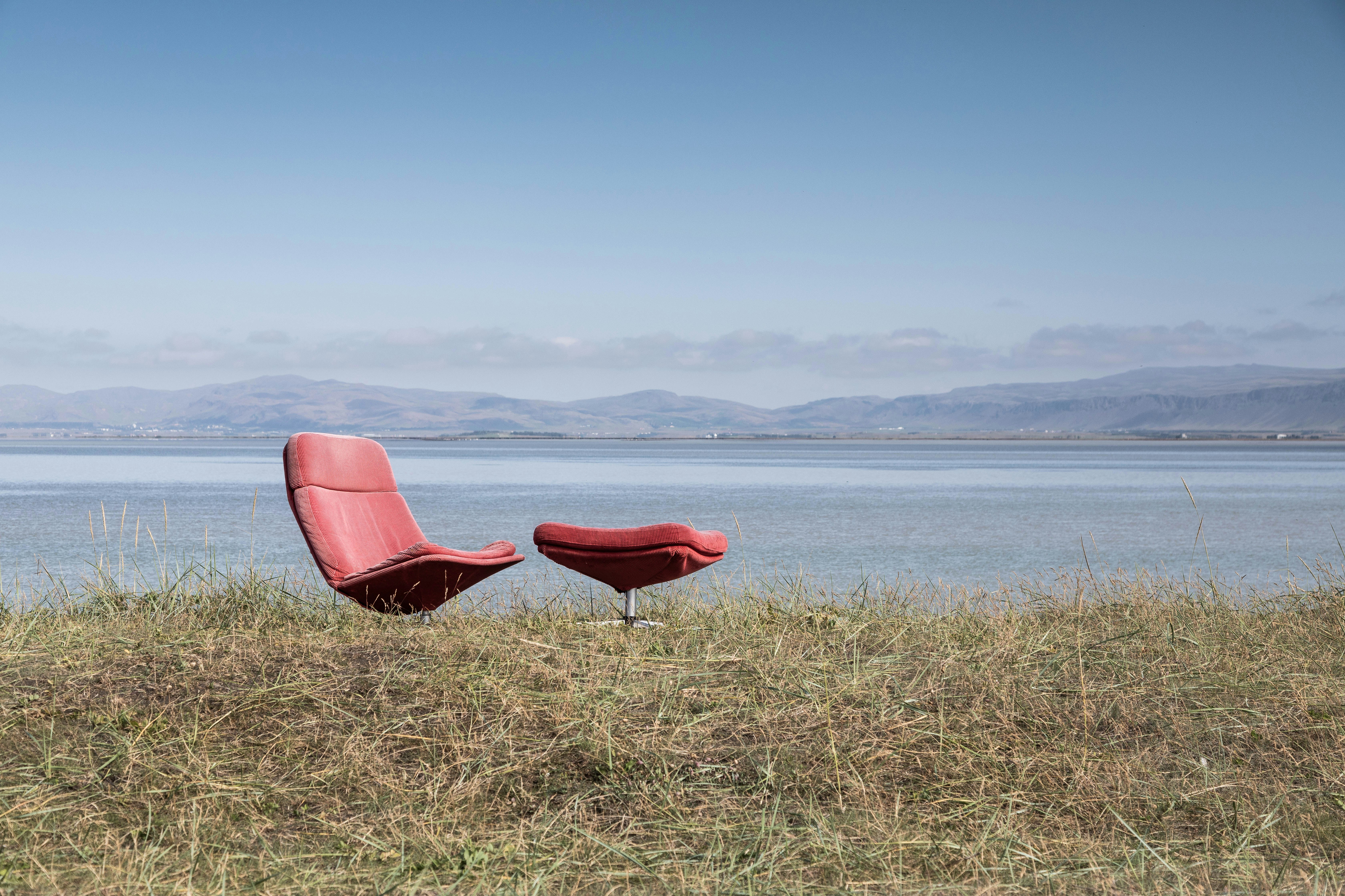 Red Lounge by the Salt Flats: A Lone Chair in Quiet Distance