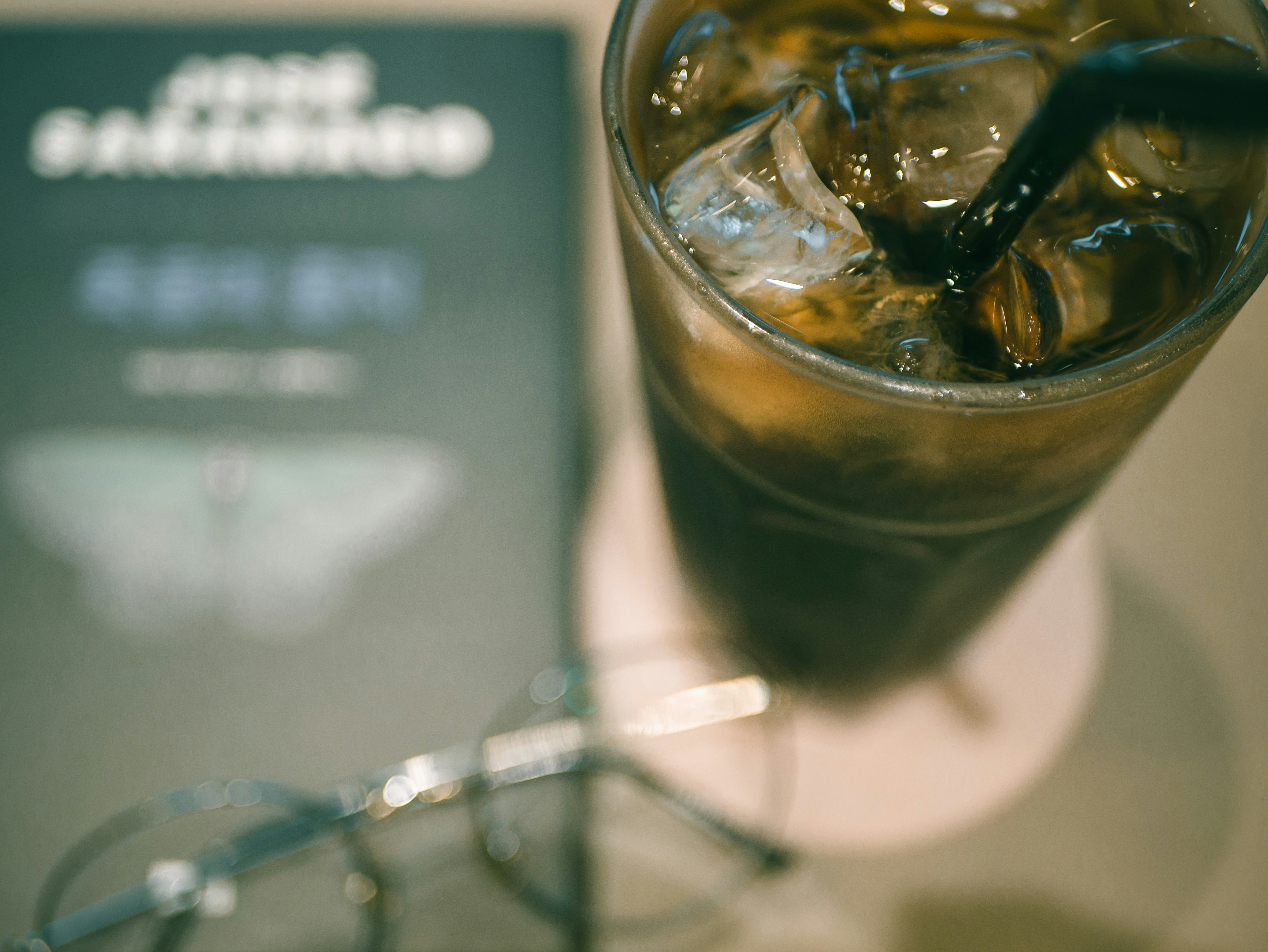 A Quiet Evening at the Bar: Glass, Glasses, and a Blurred Menu