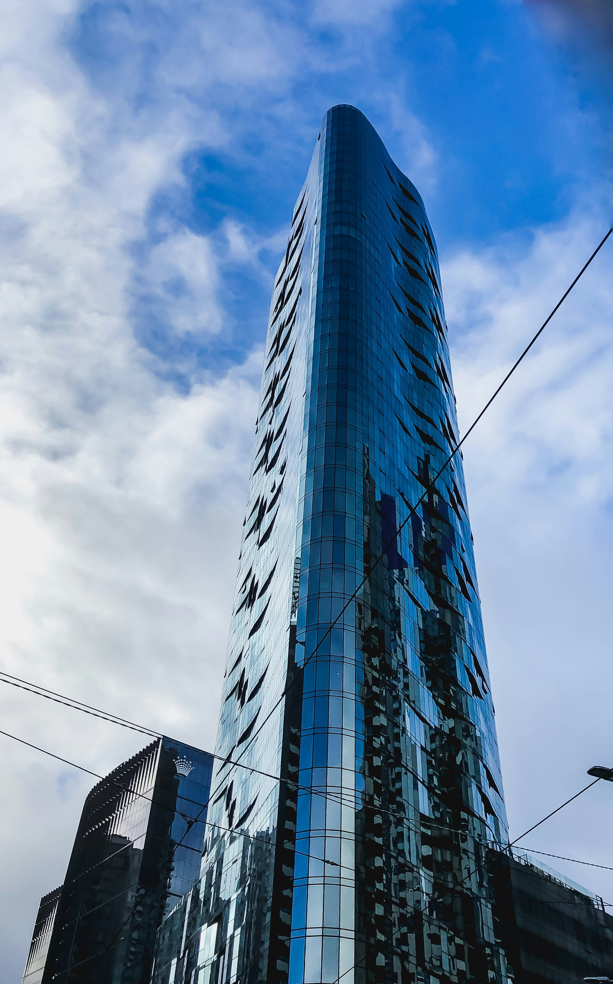 High-rise building under clouded sky photo – Free Blue Image on Unsplash