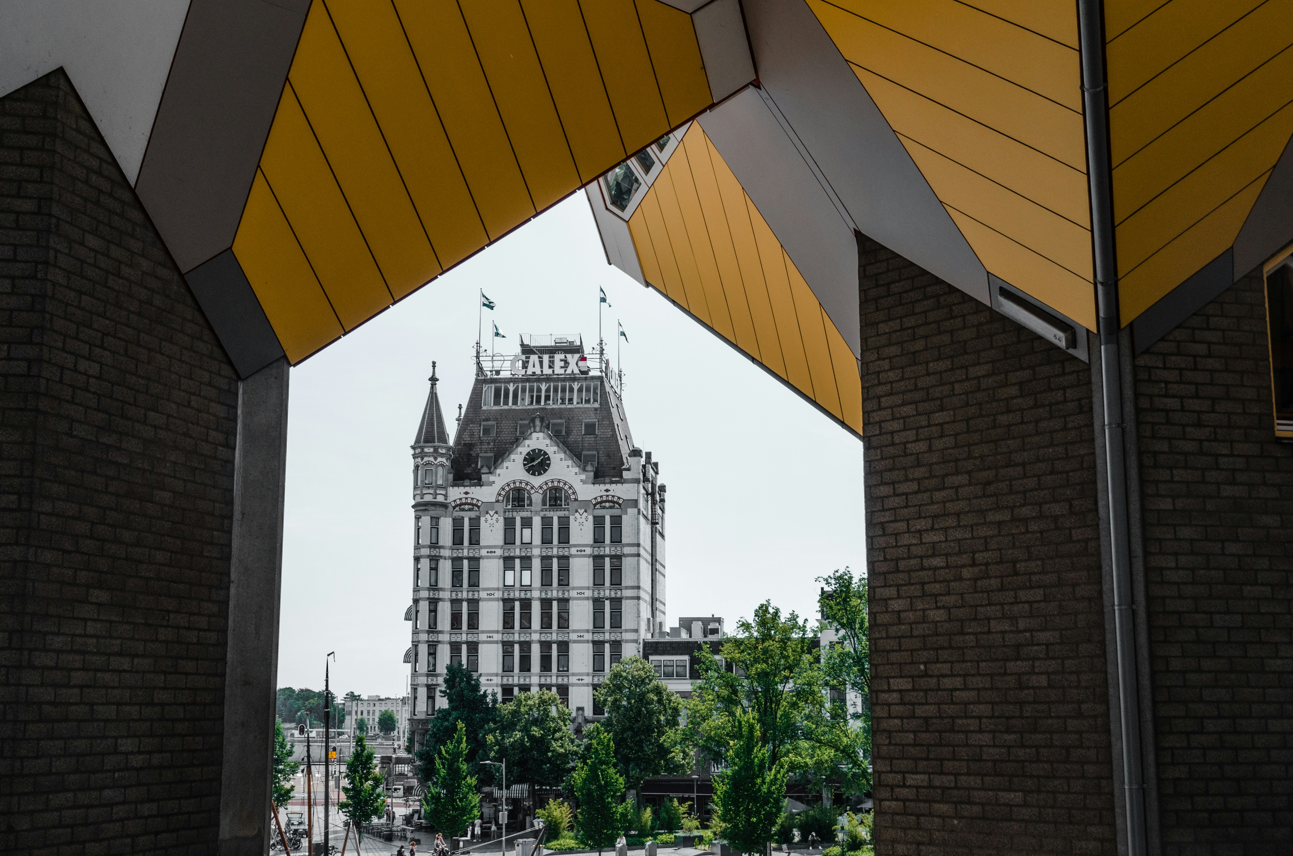 Framed in Gold: a Gothic Tower Emerges Between Angular Yellow Arches
