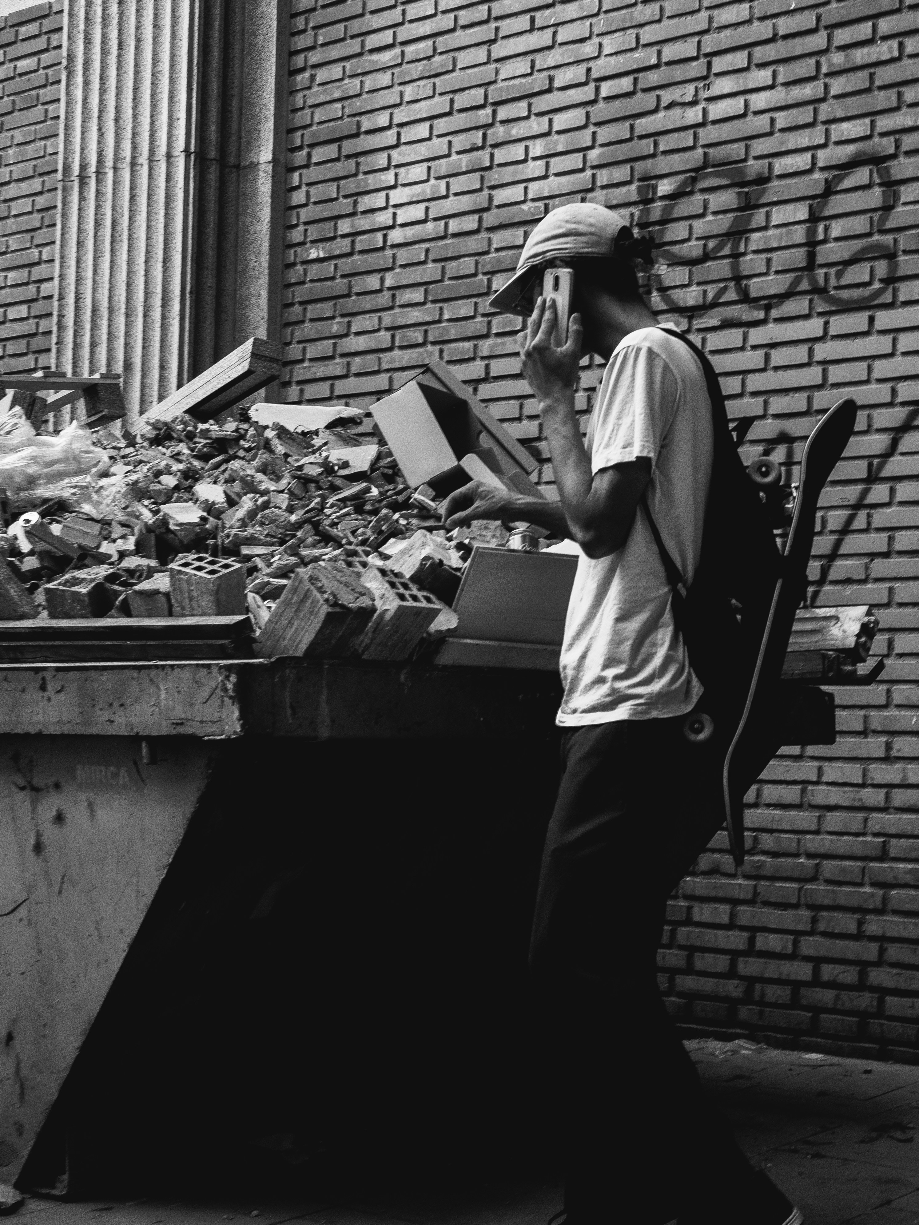 Urban Collision: A Skater on the Phone Between Brick and Debris