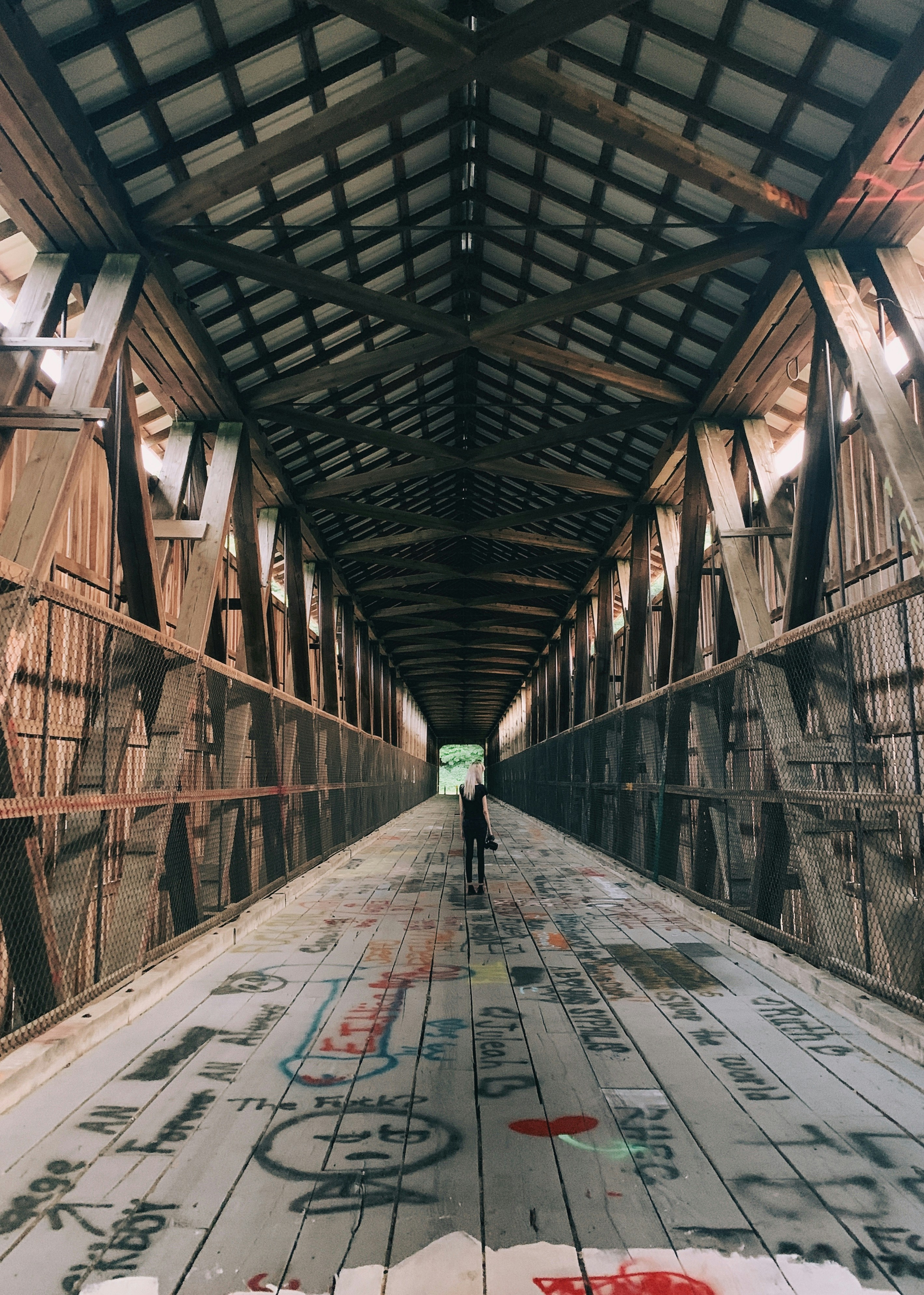 Vanishing Point: A Graffiti-Lined Covered Bridge