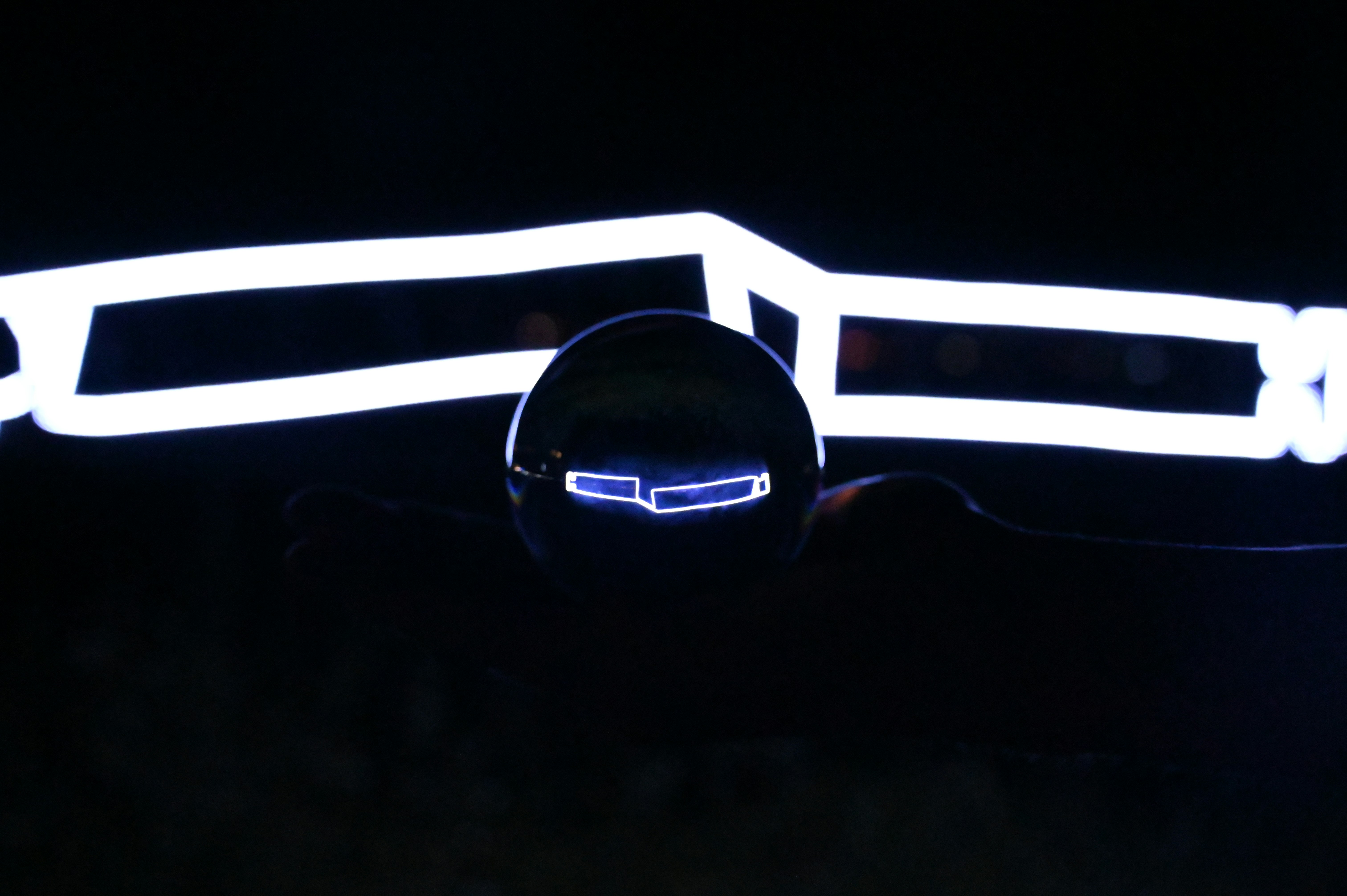 Midnight Sphere Reflecting Neon Frames