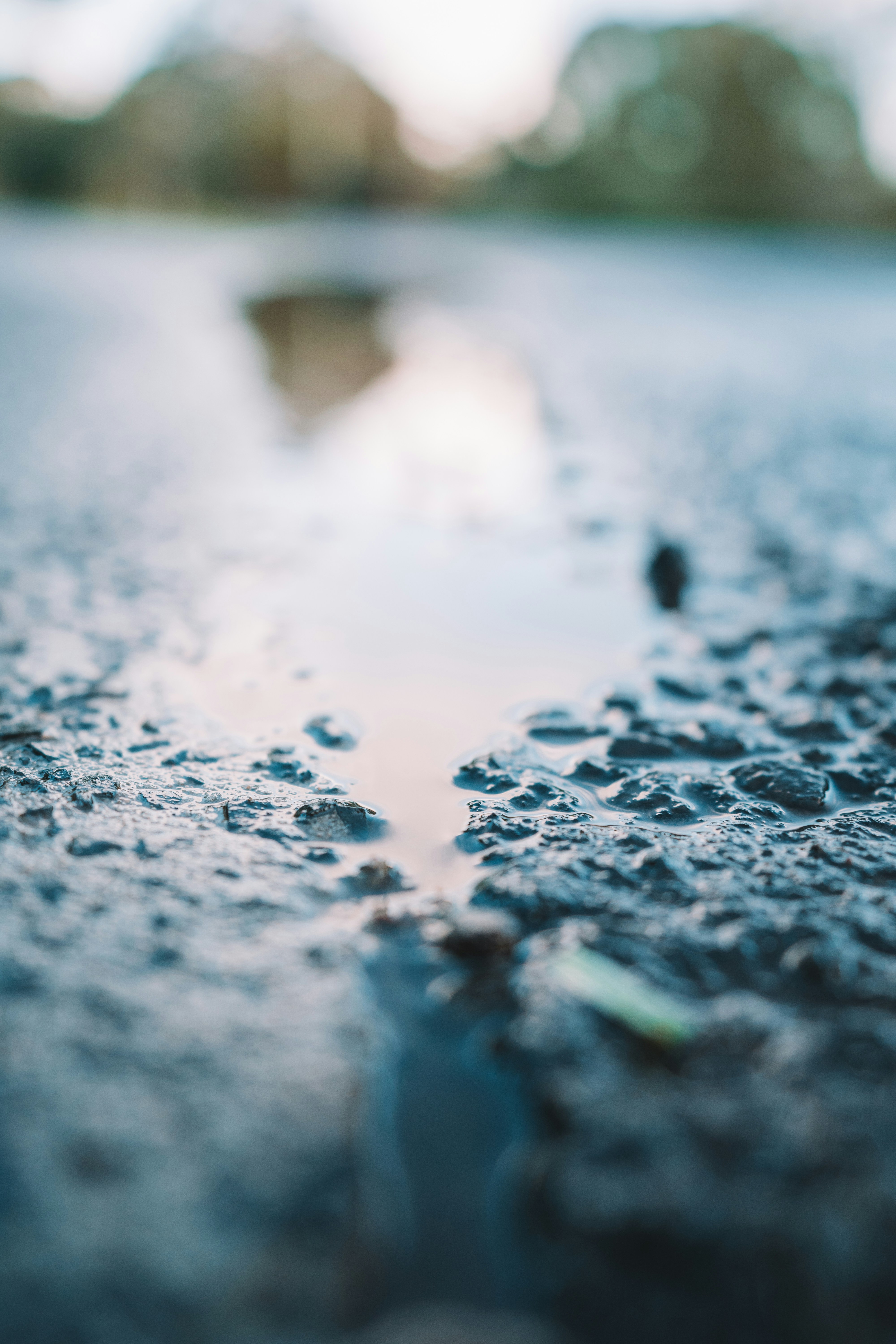 A puddle of water that is on the ground photo – Free Grey Image on Unsplash