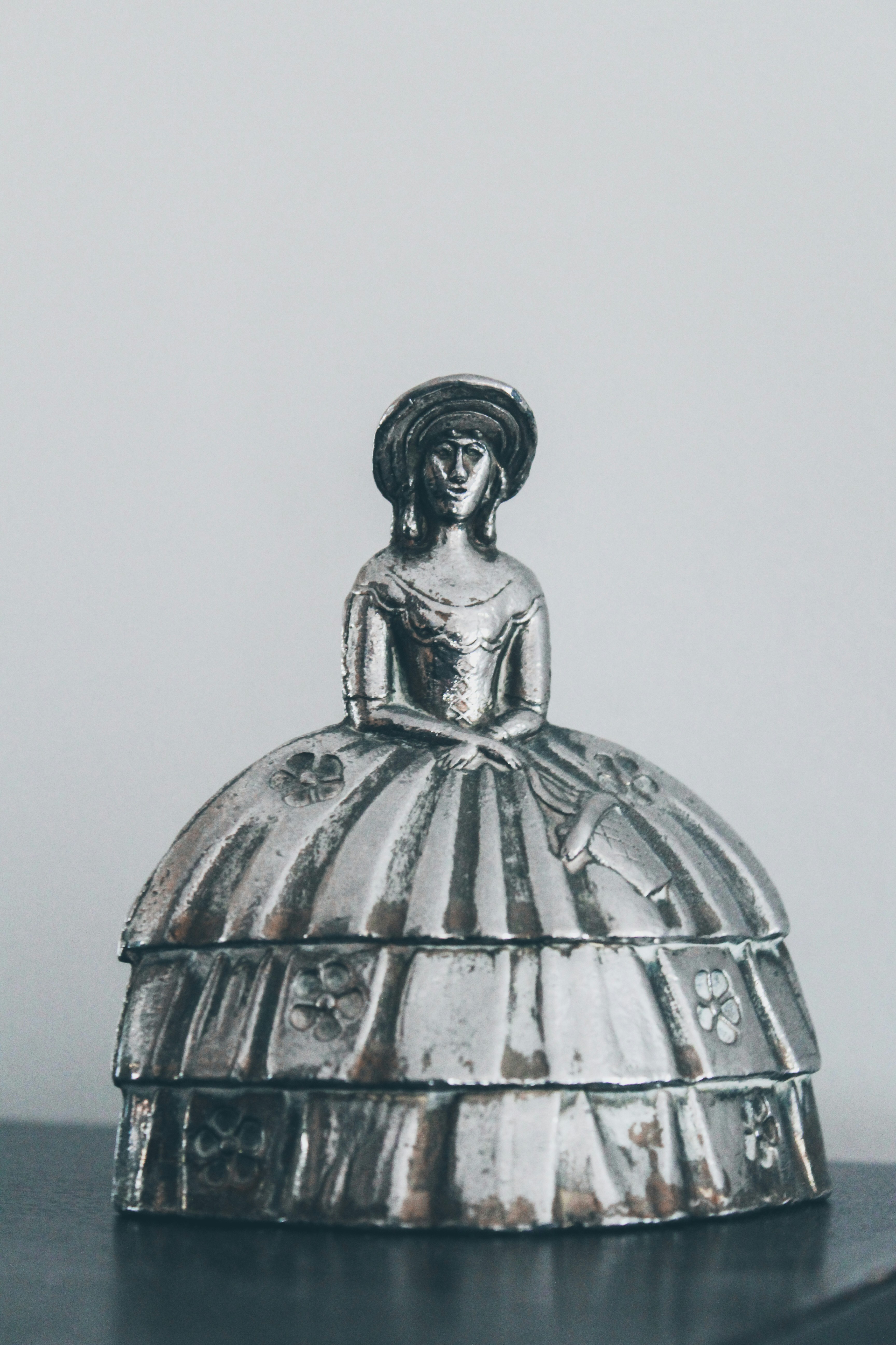 gray female character figurine