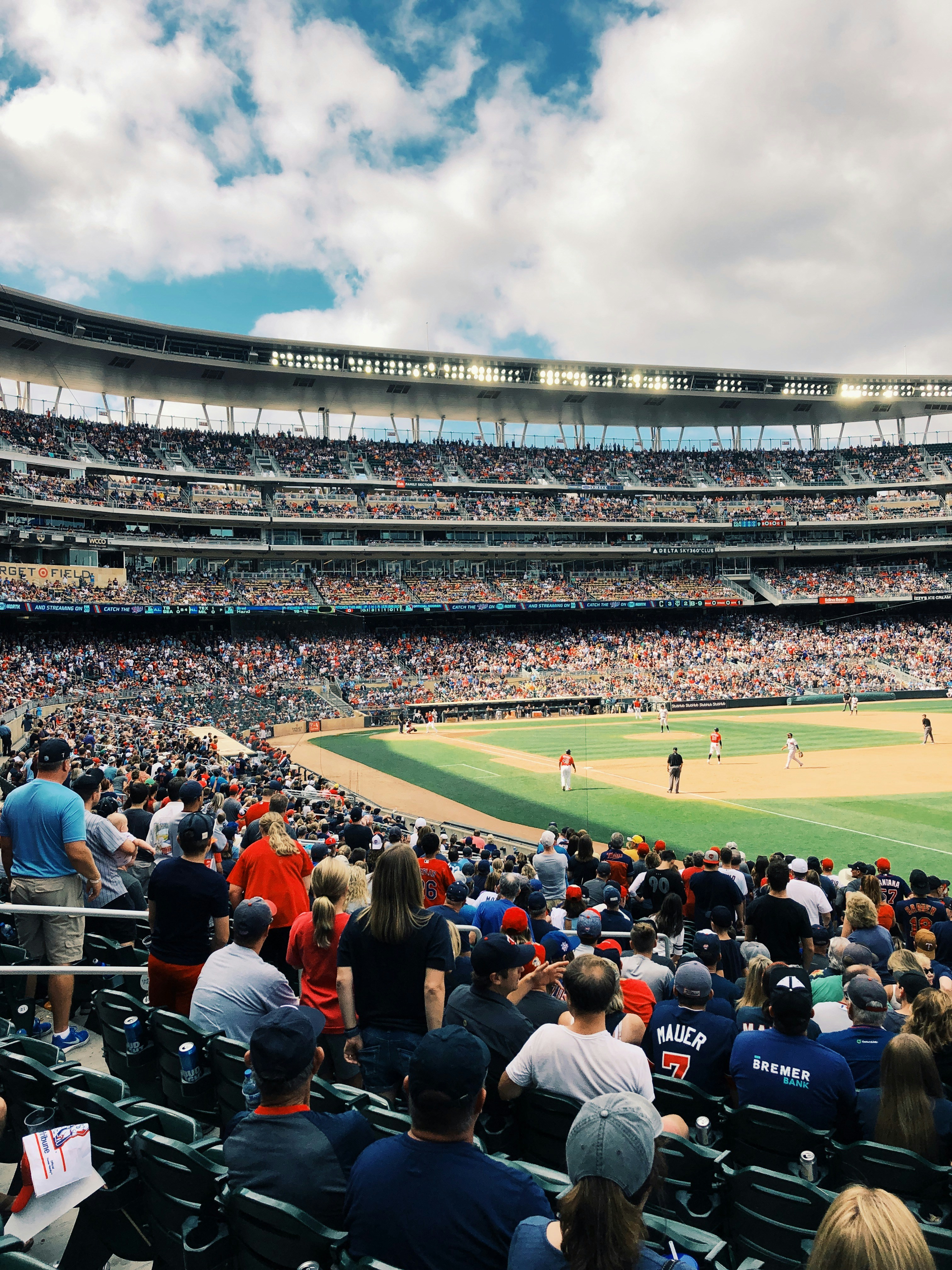 People watching baseball game under blue and white skies photo – Free ...