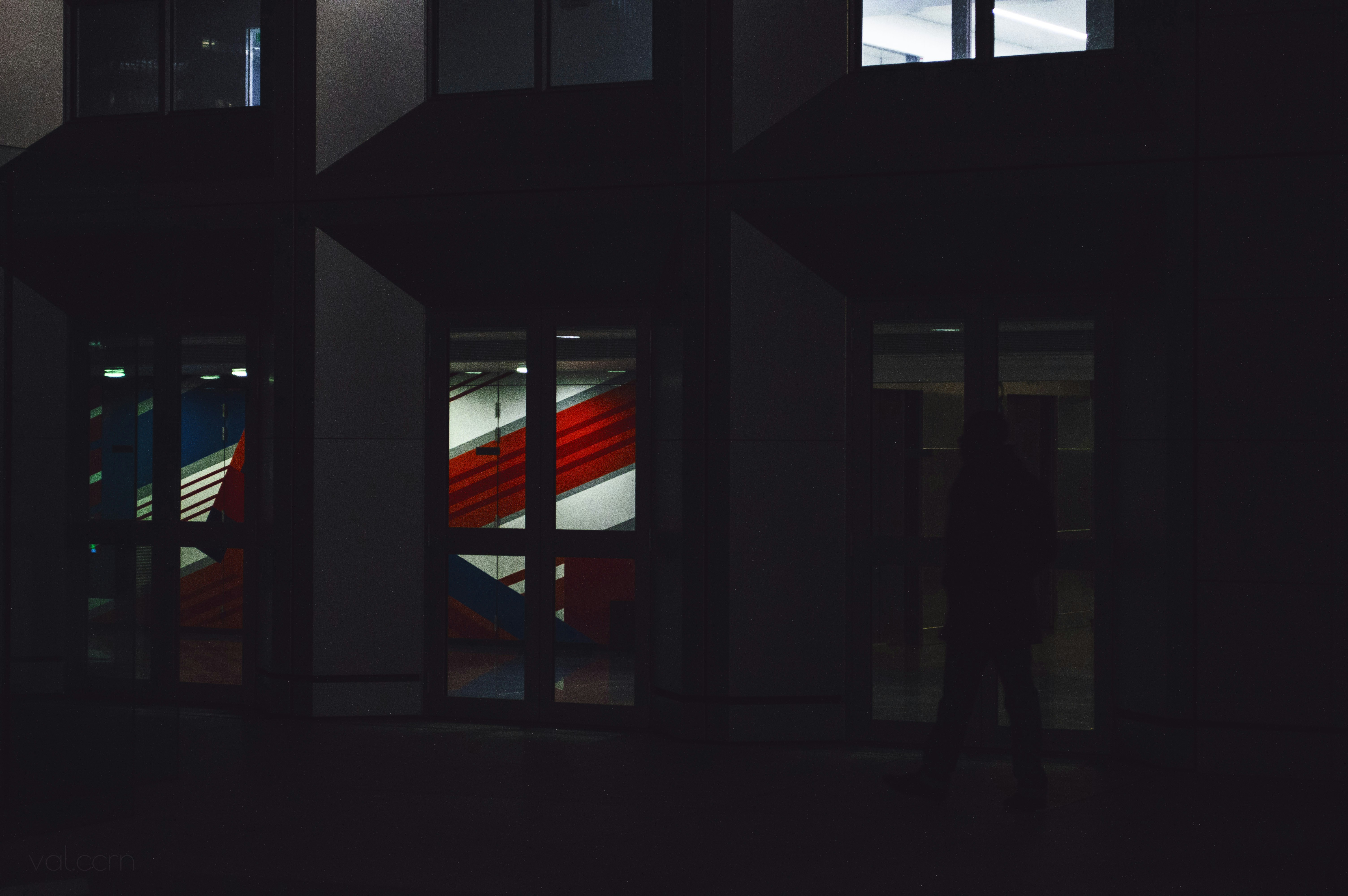 Night Glass: Neon Diagonals Behind a Quiet Facade