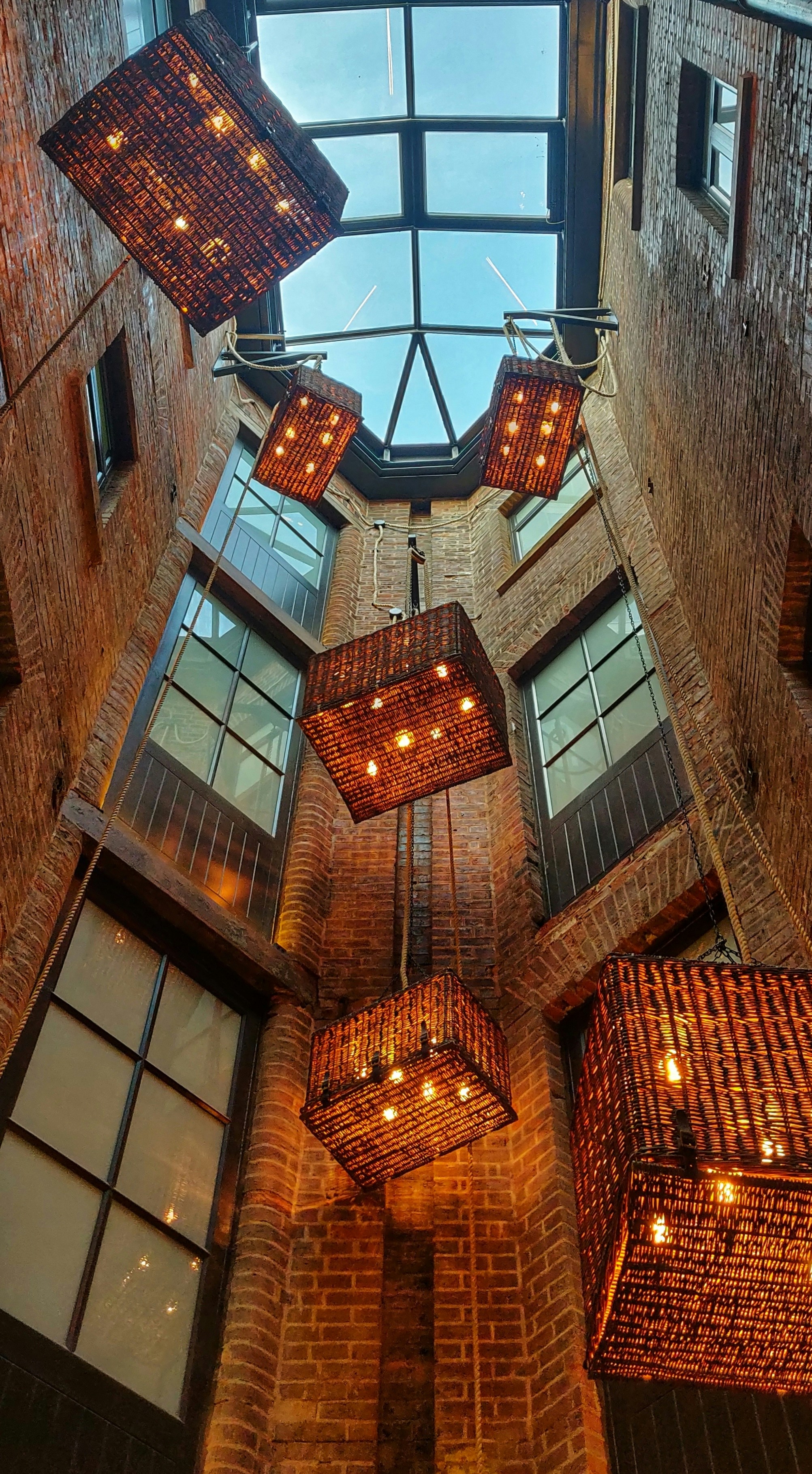 Lanterned Atrium: Copper Squares & Brick Sky