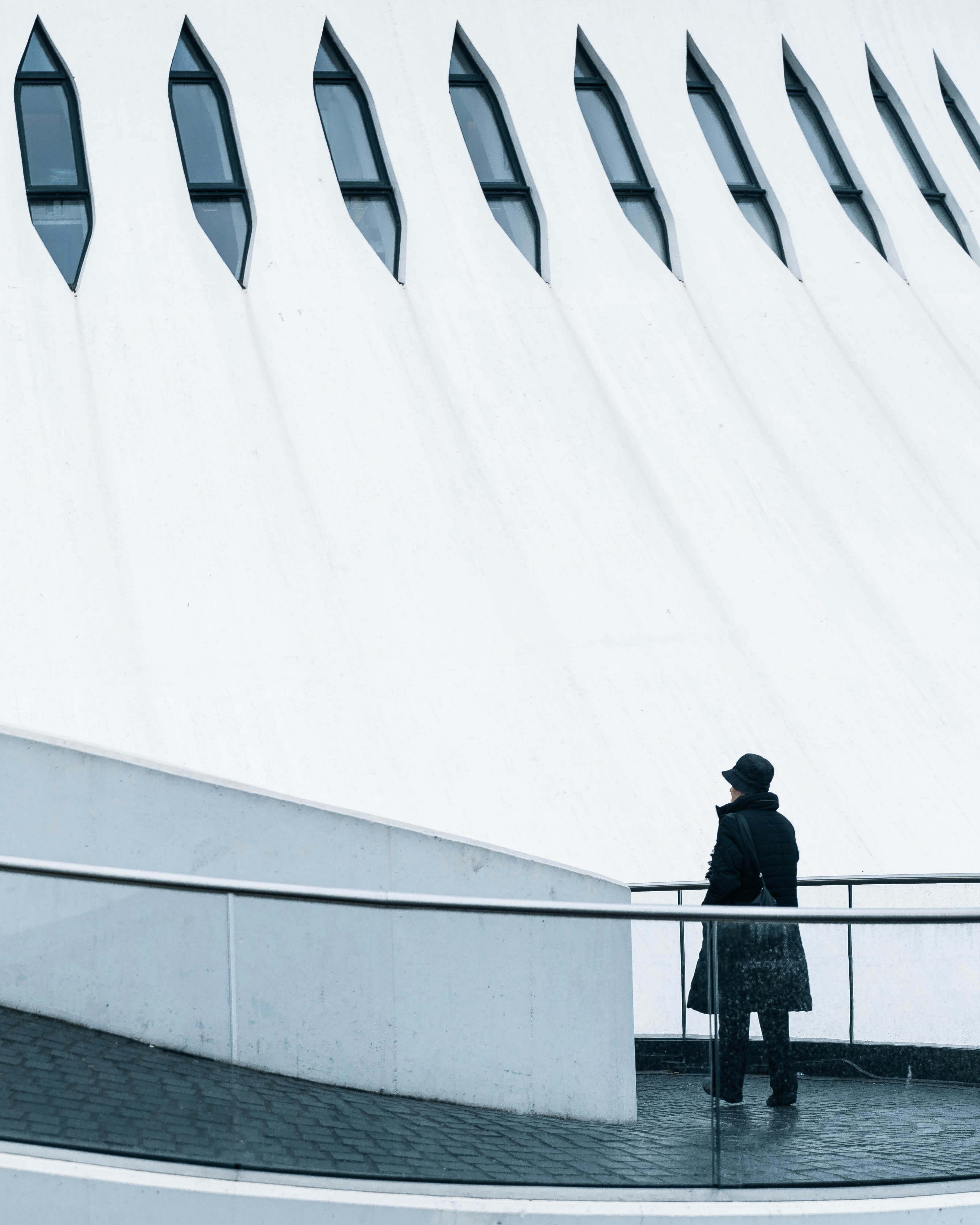 Person standing beside wall photo – Free White Image on Unsplash