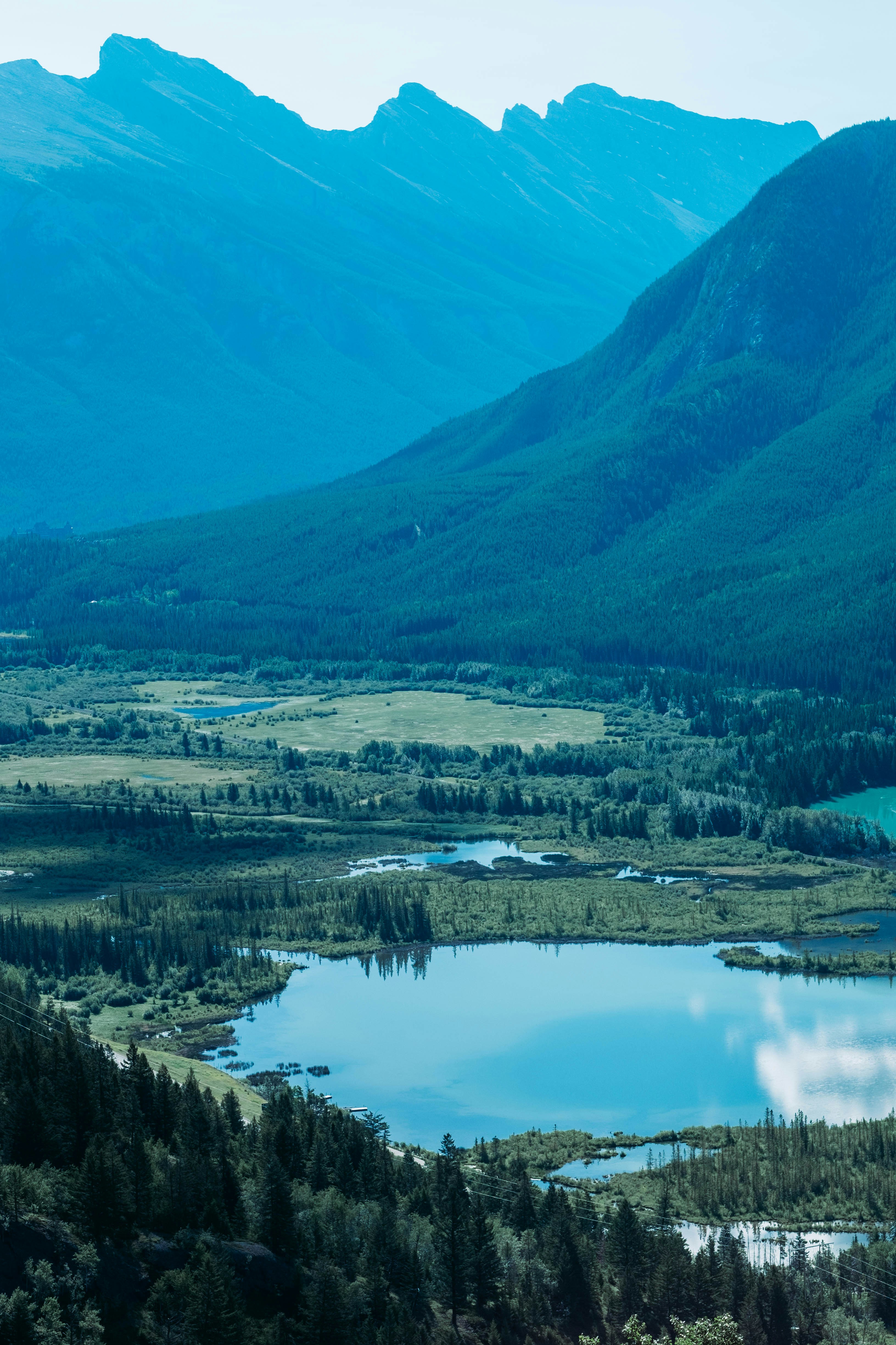 Blue Veil Over the Valley: Glacier Lakes Amid Mountain Ranges