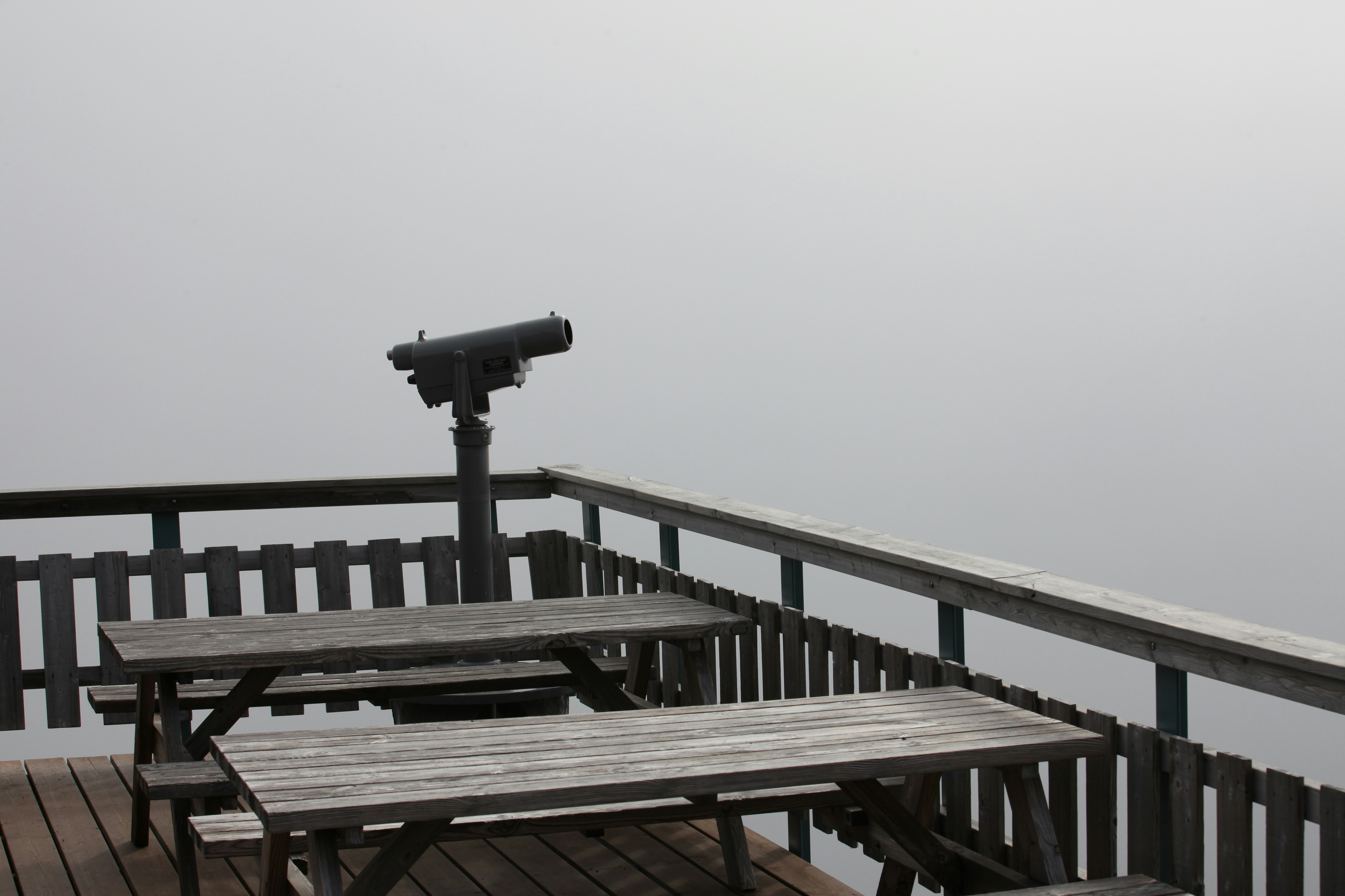 Mistbound Overlook: A Weathered Deck Keeps Watch Over the Edge