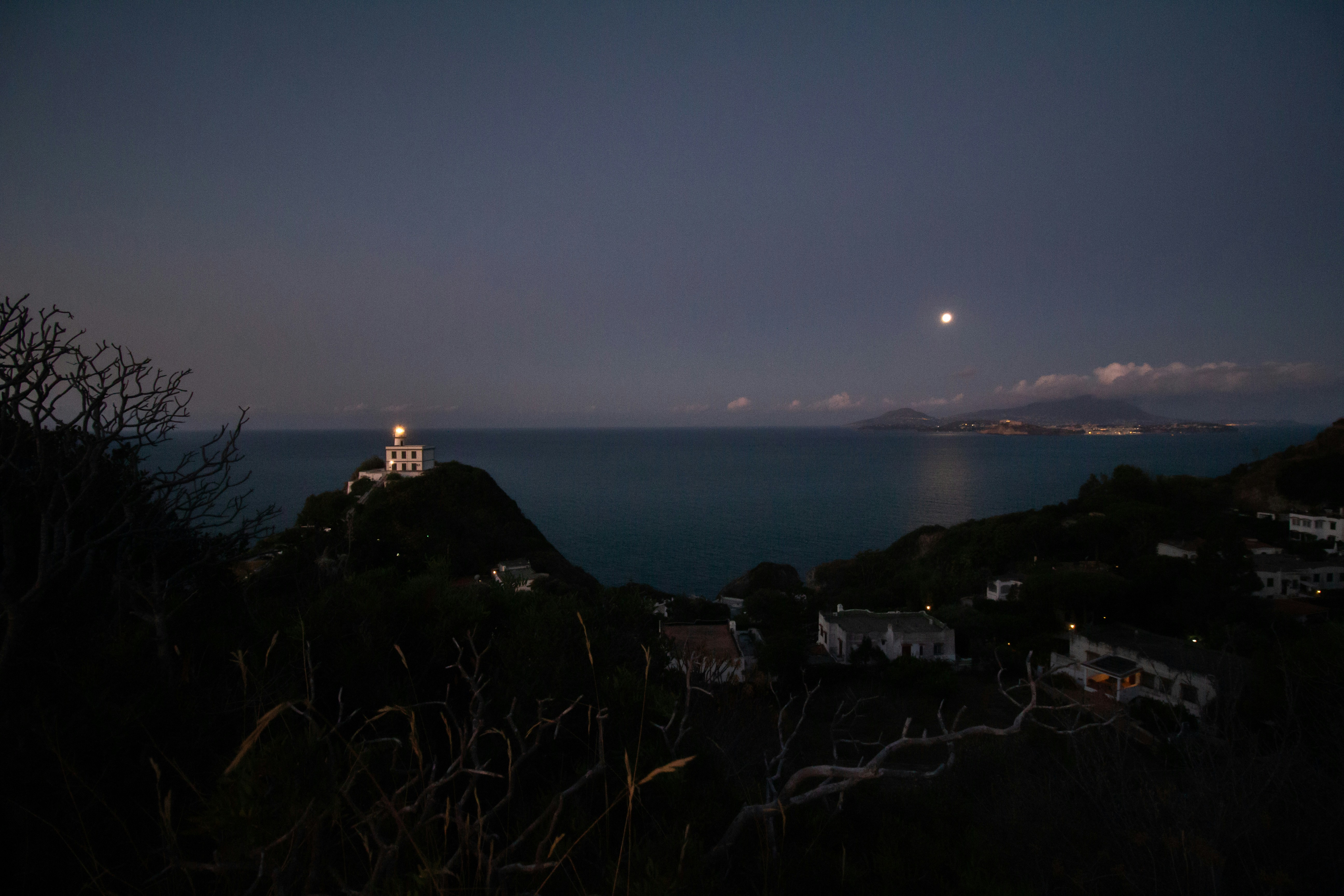 Lunar Glow Over a Coastal Village
