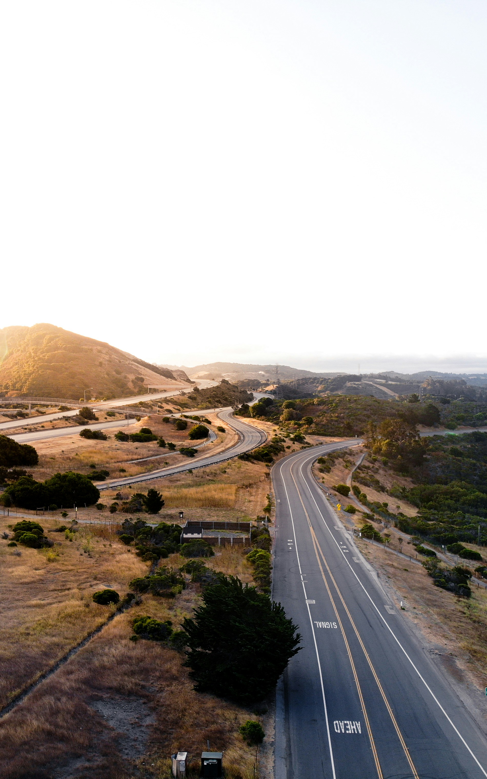 Vanishing Curve: A Desert Highway Woven Through Golden Hills