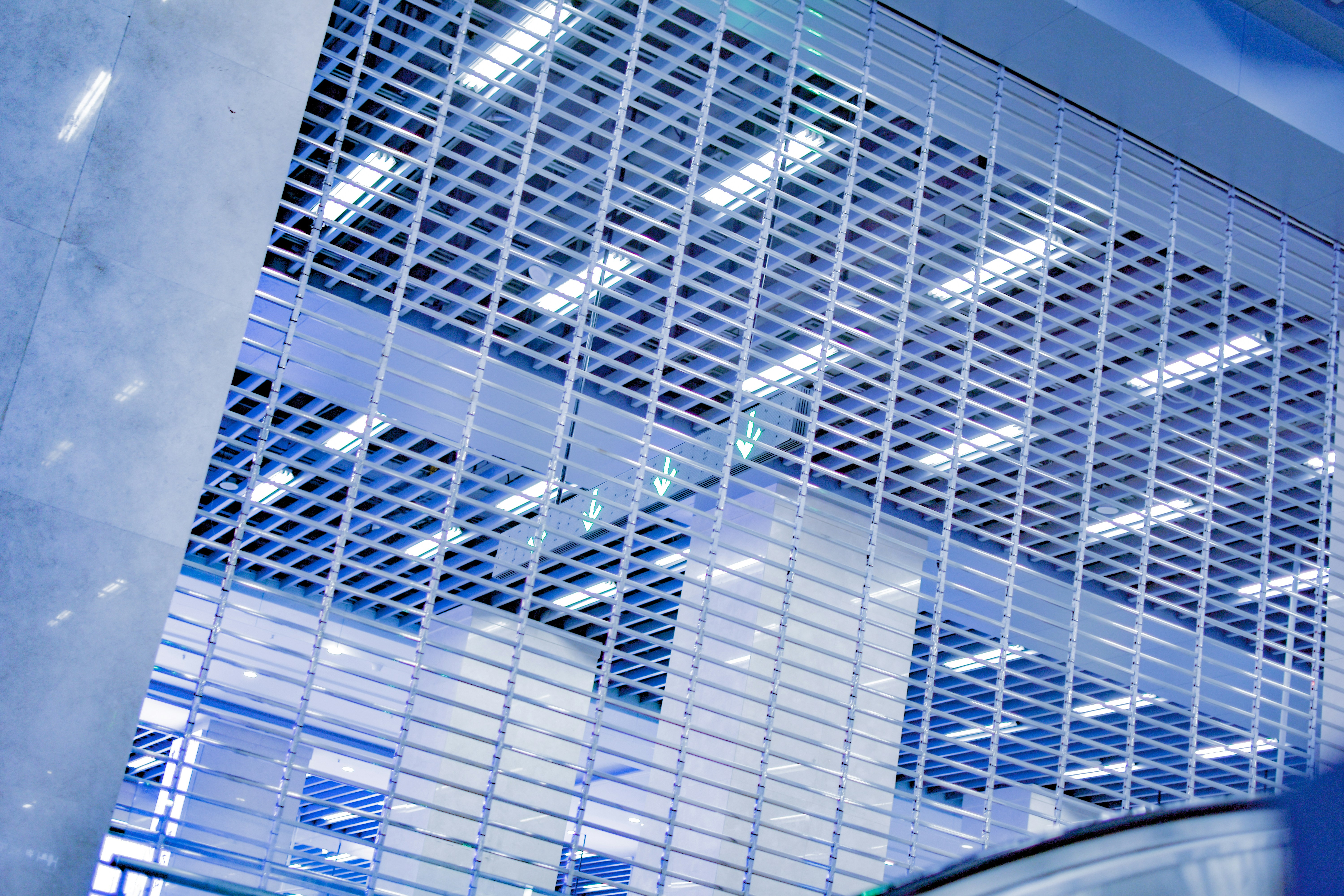 A building that has a bunch of windows in it photo – Free Blue Image on ...