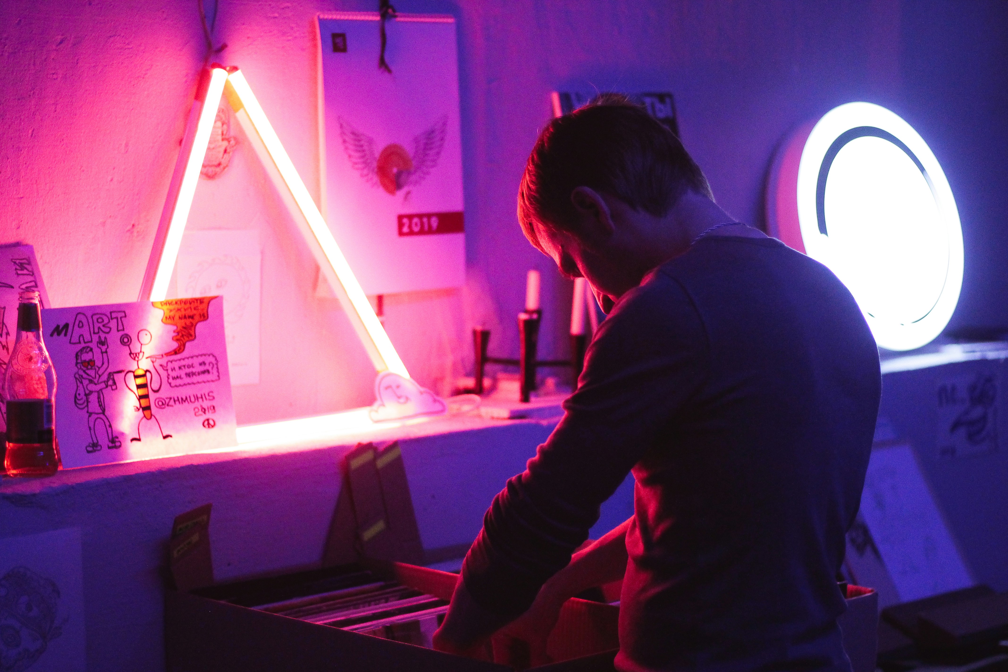 Neon-Backlit DJ in a Blues-Purple Club
