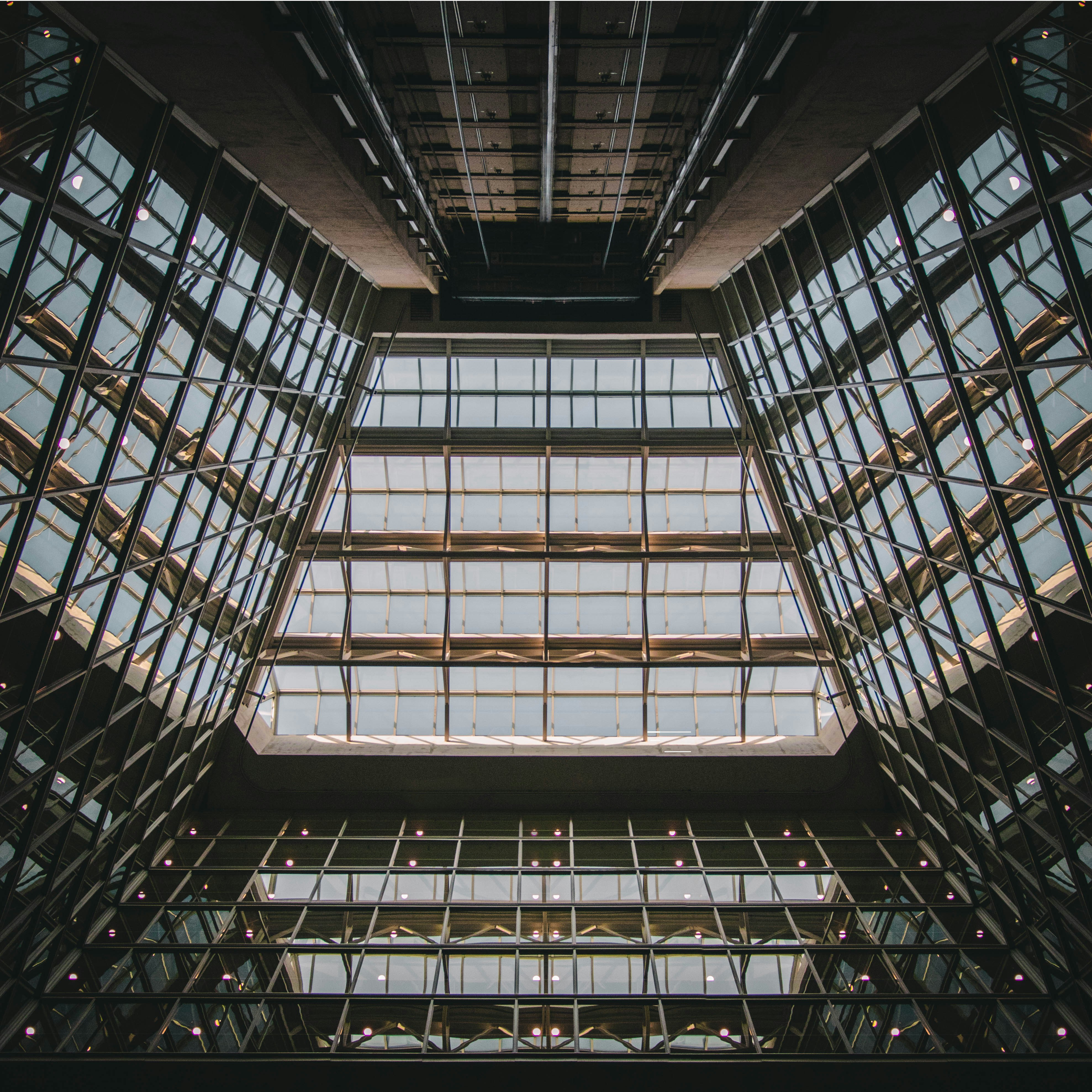 Skyward Grid: Symmetry and Light in a Modern Glass Atrium